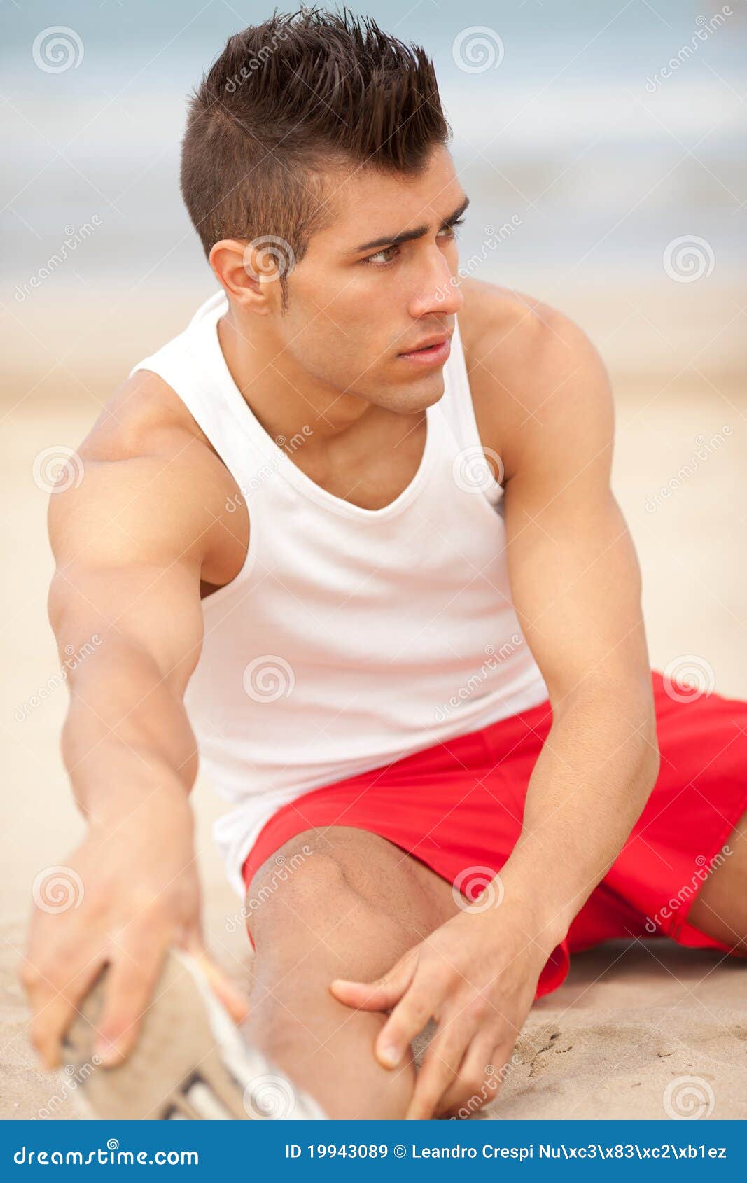 Young Men Making Elongation Exersice Stock Image - Image of ocean ...