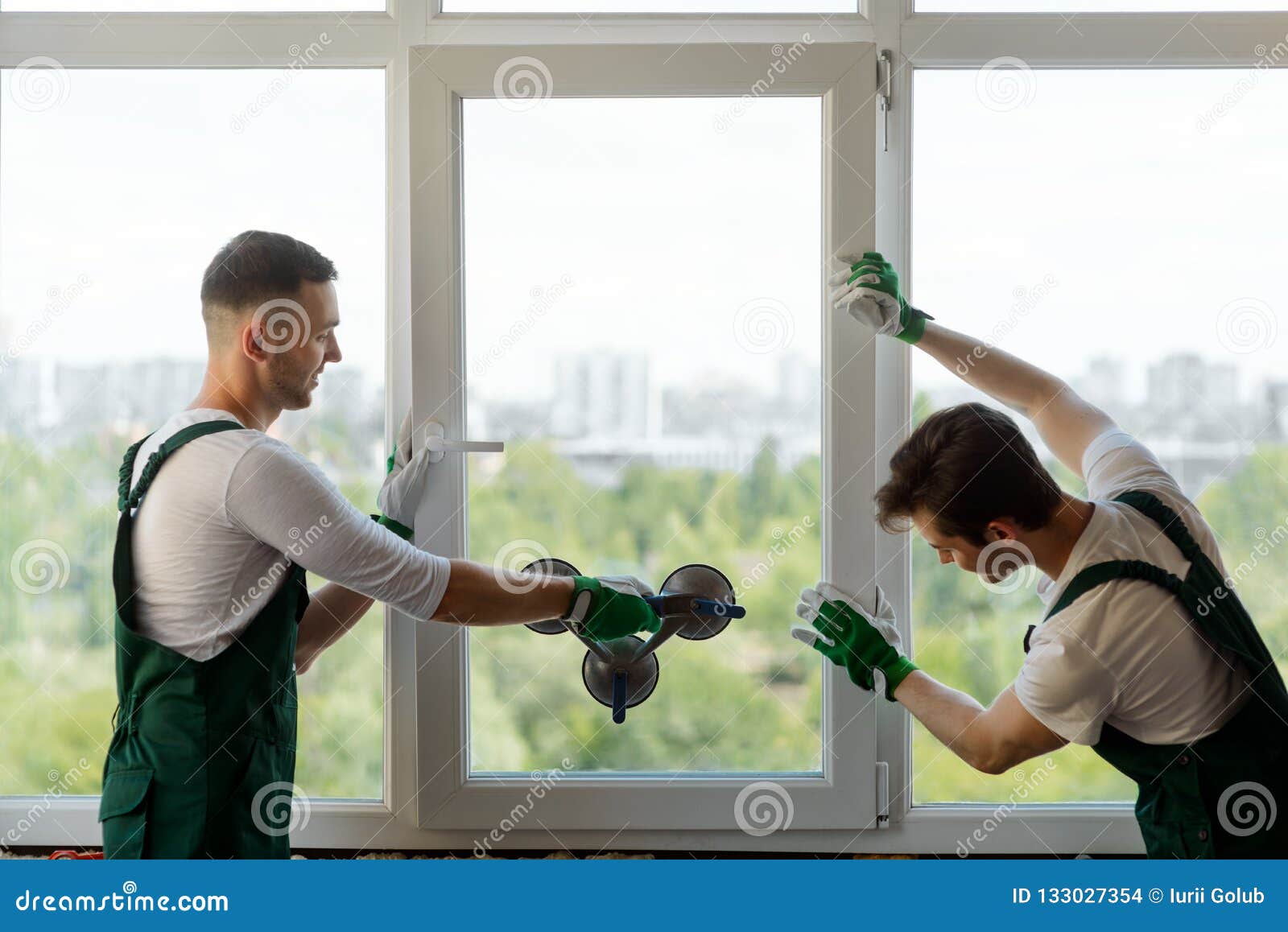 Men Mounting a Window Section Stock Photo - Image of hands, house ...