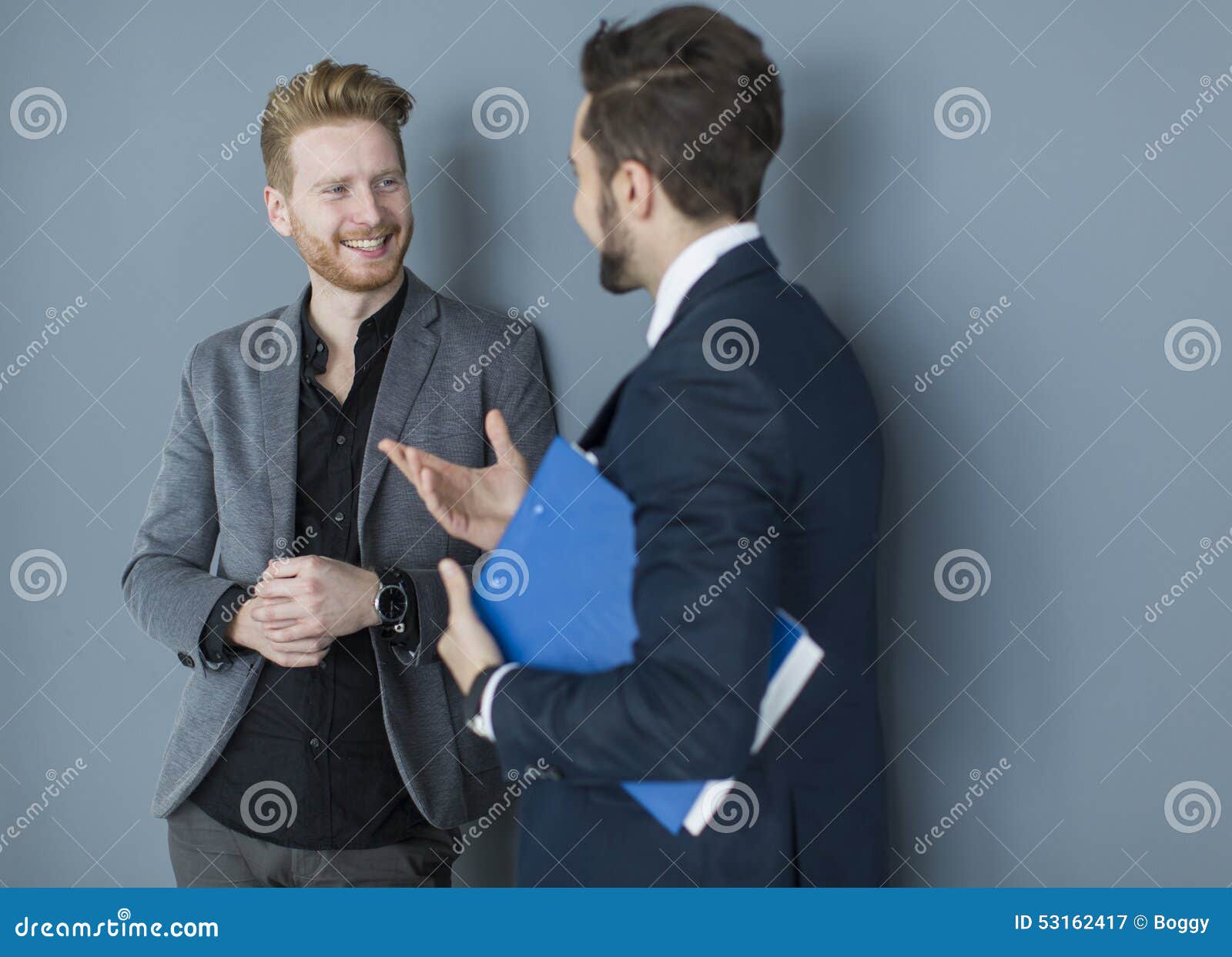 Young men in the office stock image. Image of folder - 53162417
