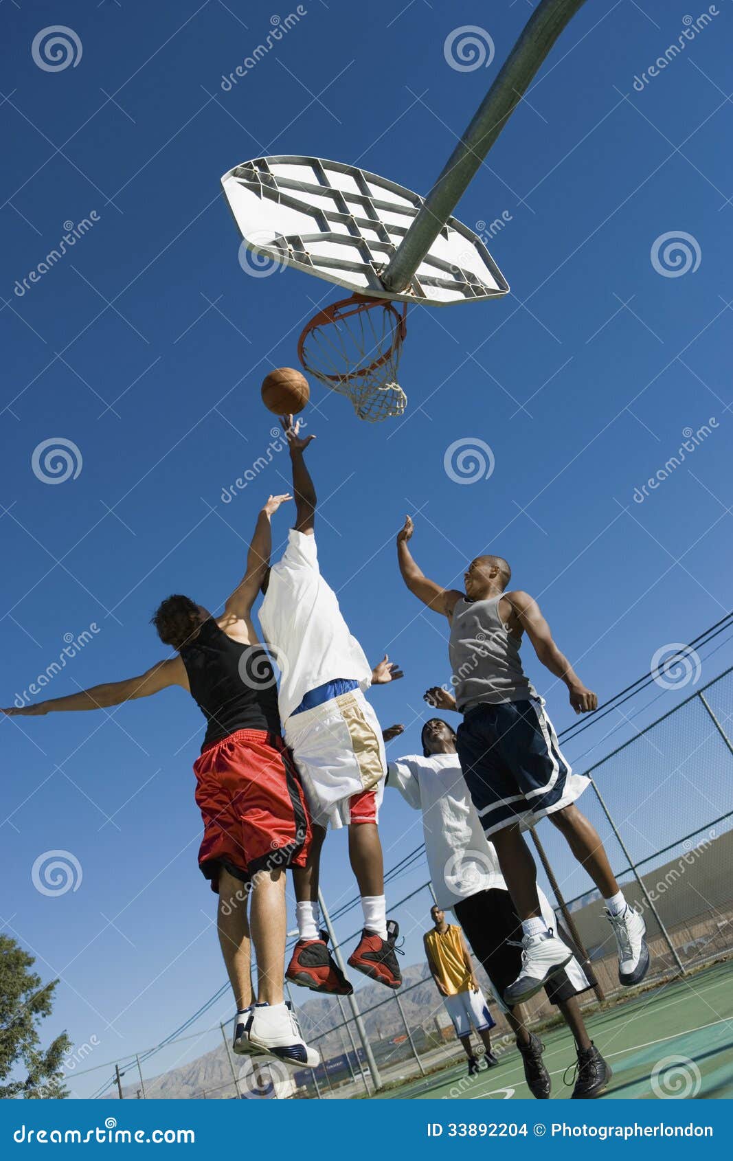 Young Men Playing Basketball on Court Stock Photo - Image of energy ...