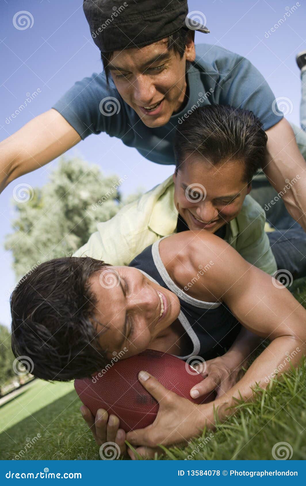 Young Men Playing Football. Stock Photo - Image of shoulders, soccer ...
