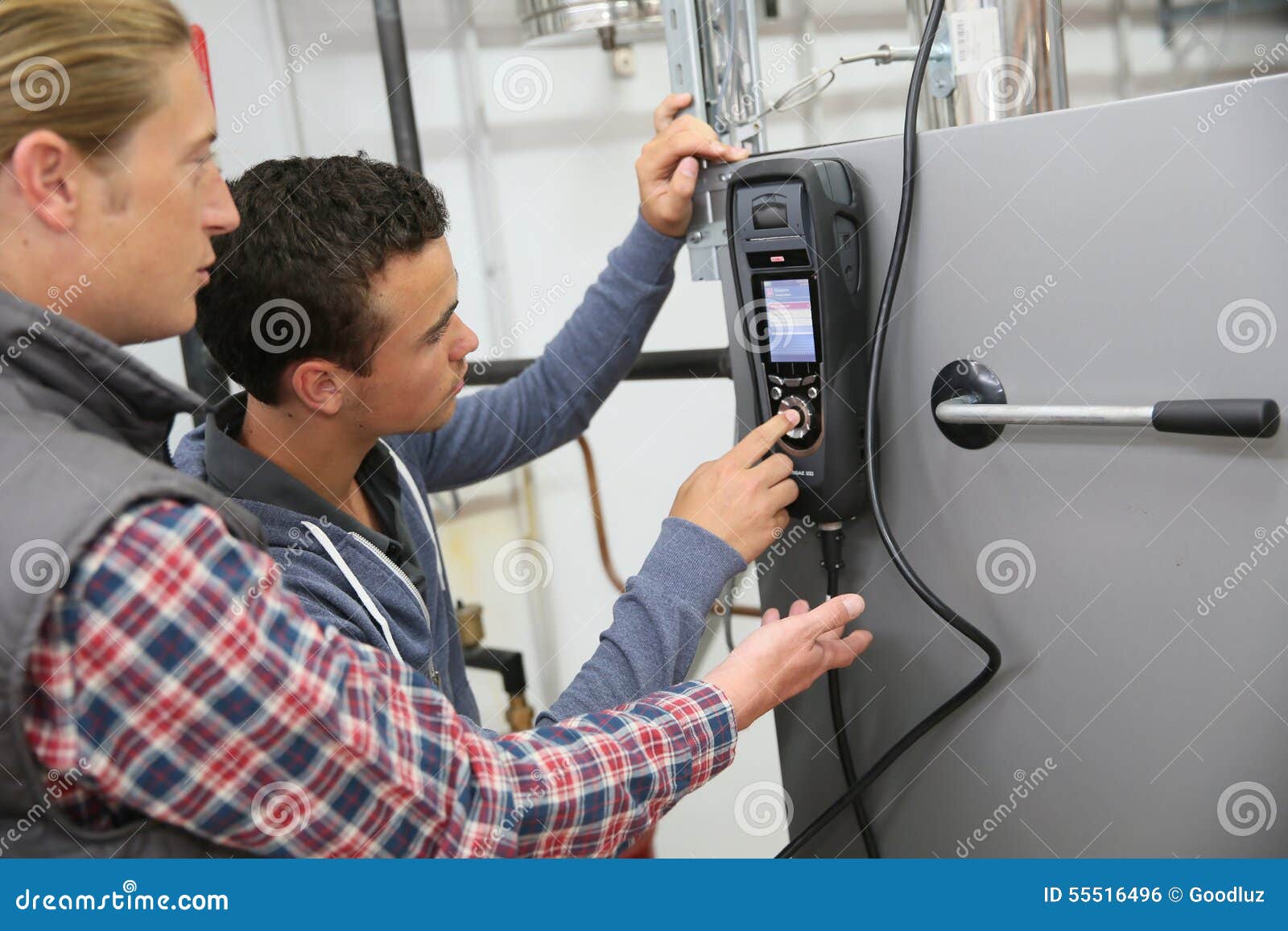 Young Men in Professional Training Controlling Heat Pump Stock Photo ...