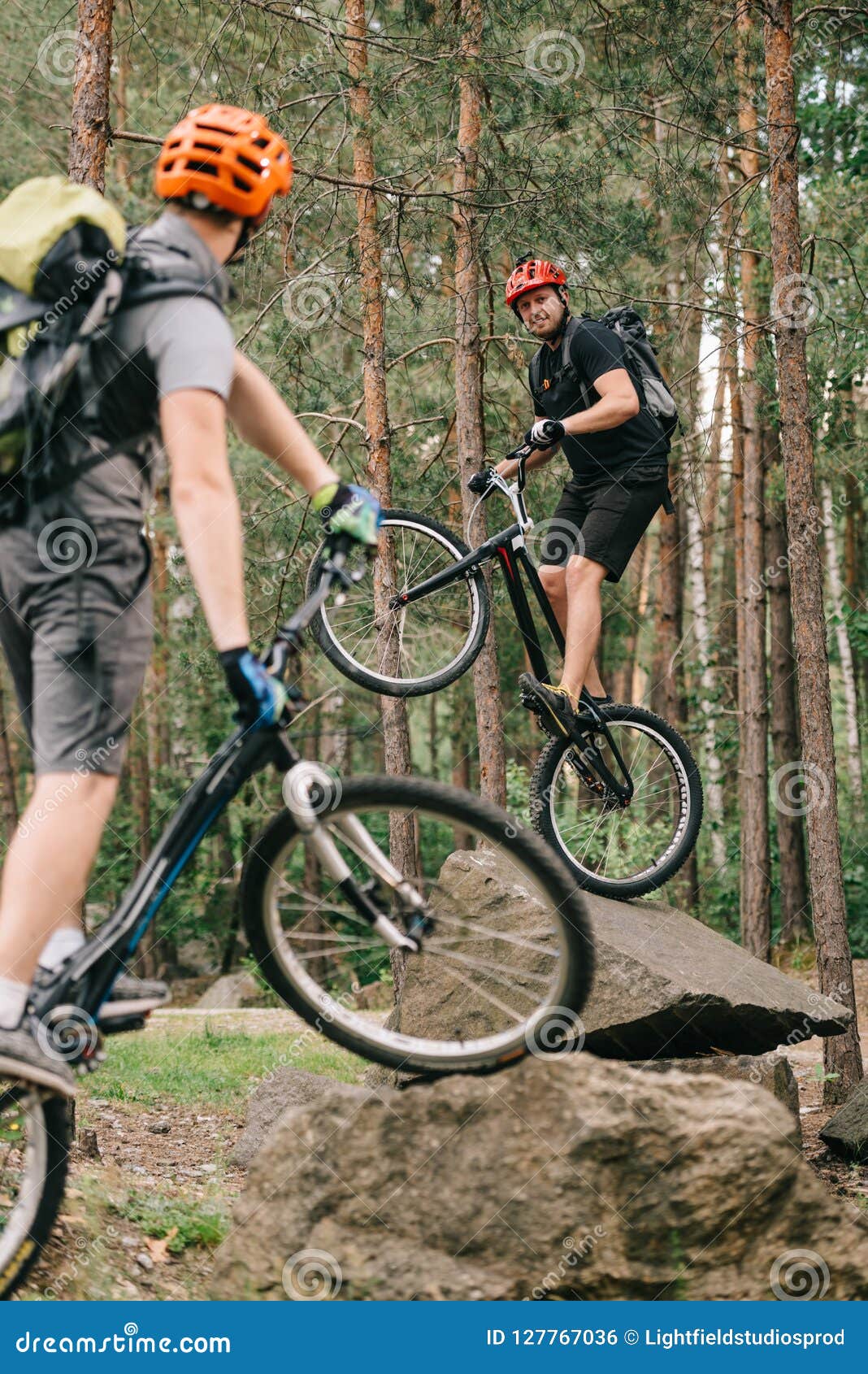 Young Men Riding on Trial Bicycles Stock Photo - Image of skill ...