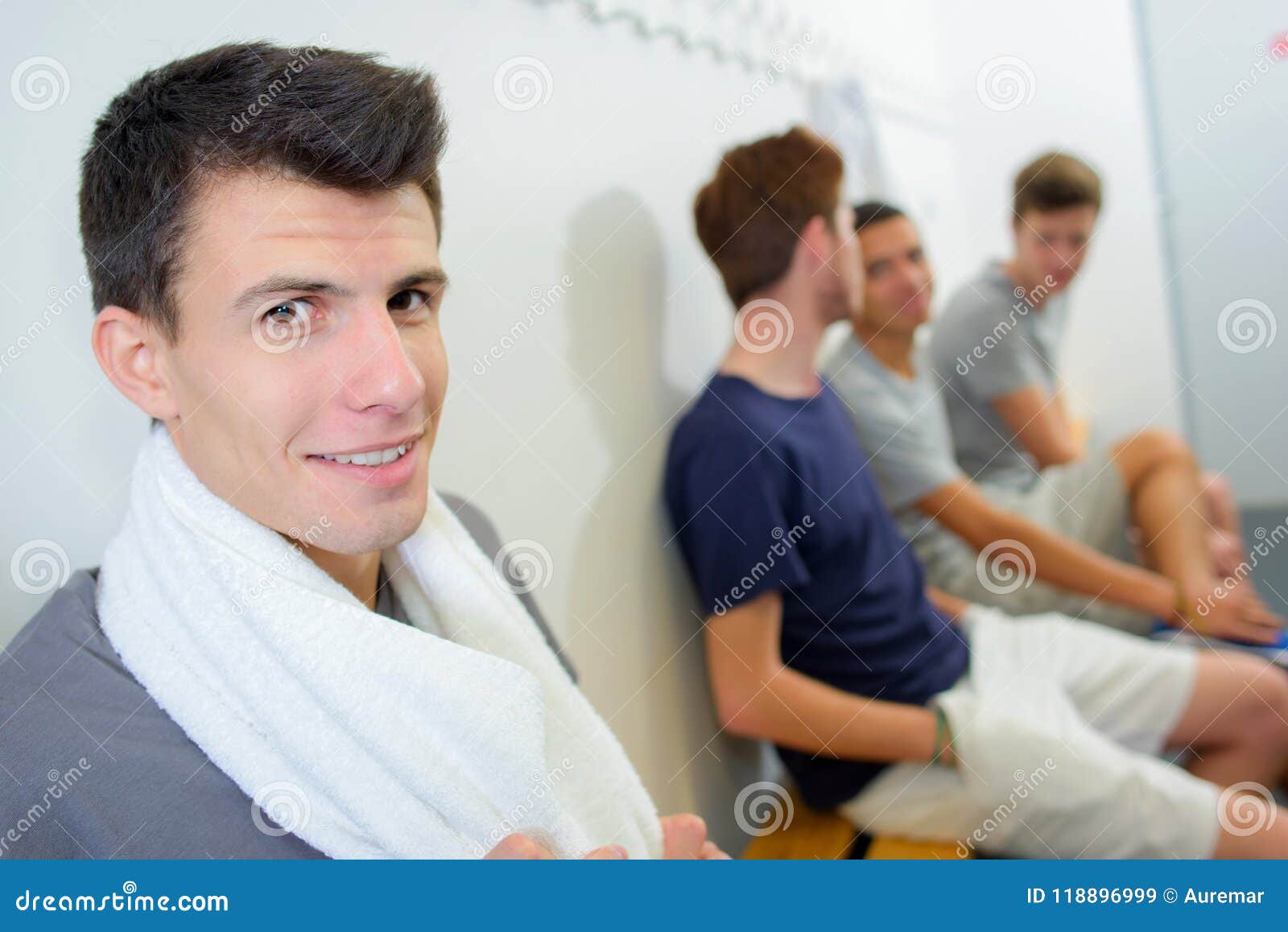 Young Men Sat in Changing Room Stock Image - Image of changing, four ...