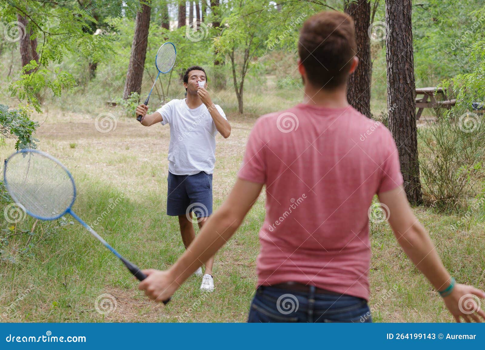Young Men Serving Shuttlecock Outdoors Stock Image - Image of grandson ...