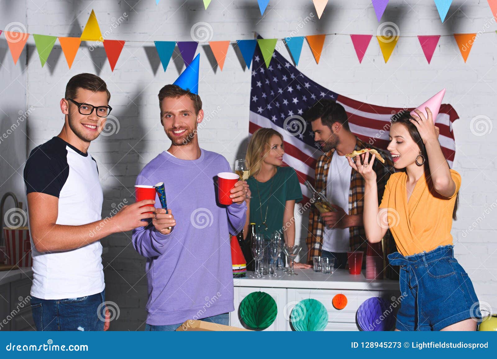 Young Men Smiling at Camera while Drinking Beer and Partying Stock ...