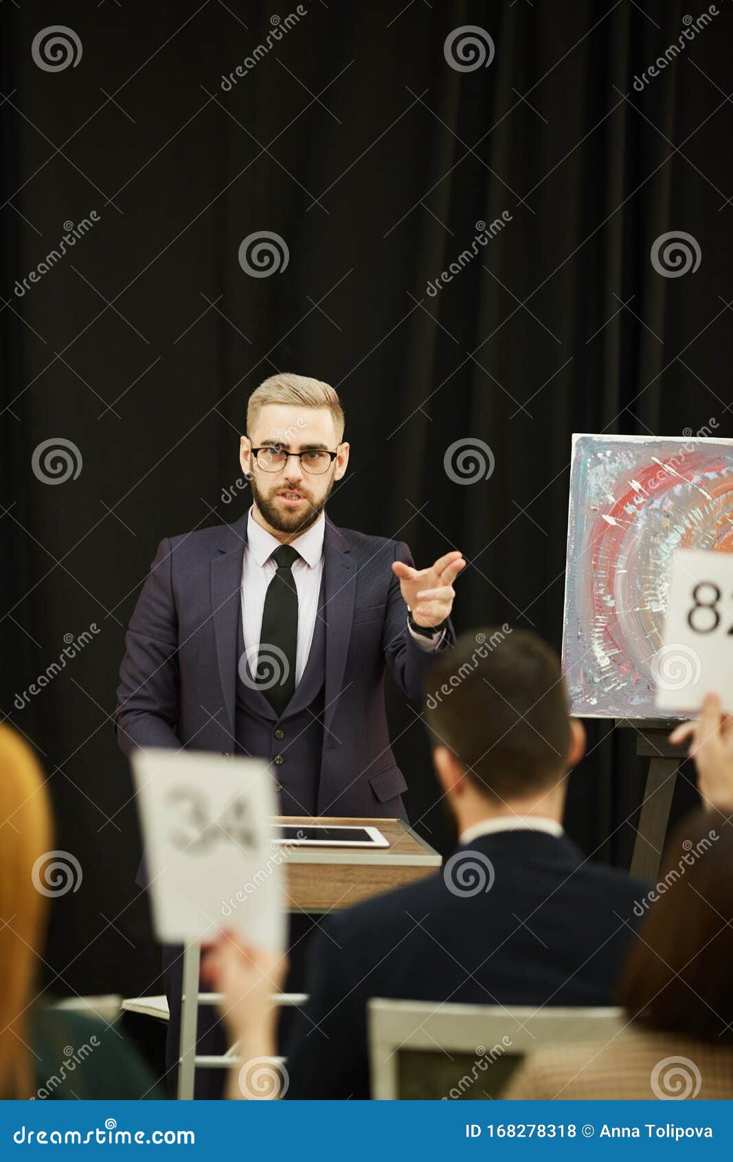 Man working at auction stock photo. Image of looking - 168278318