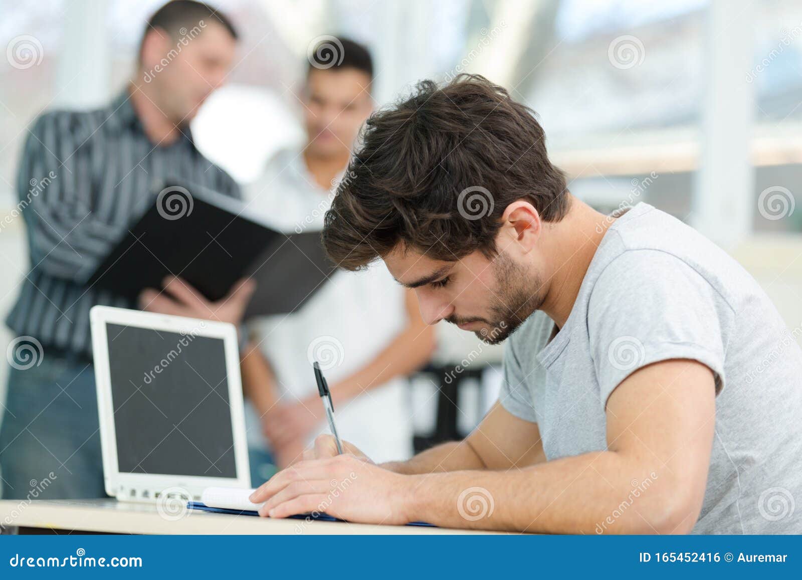 Young Man Taking Notes Student Stock Photo - Image of laptop ...