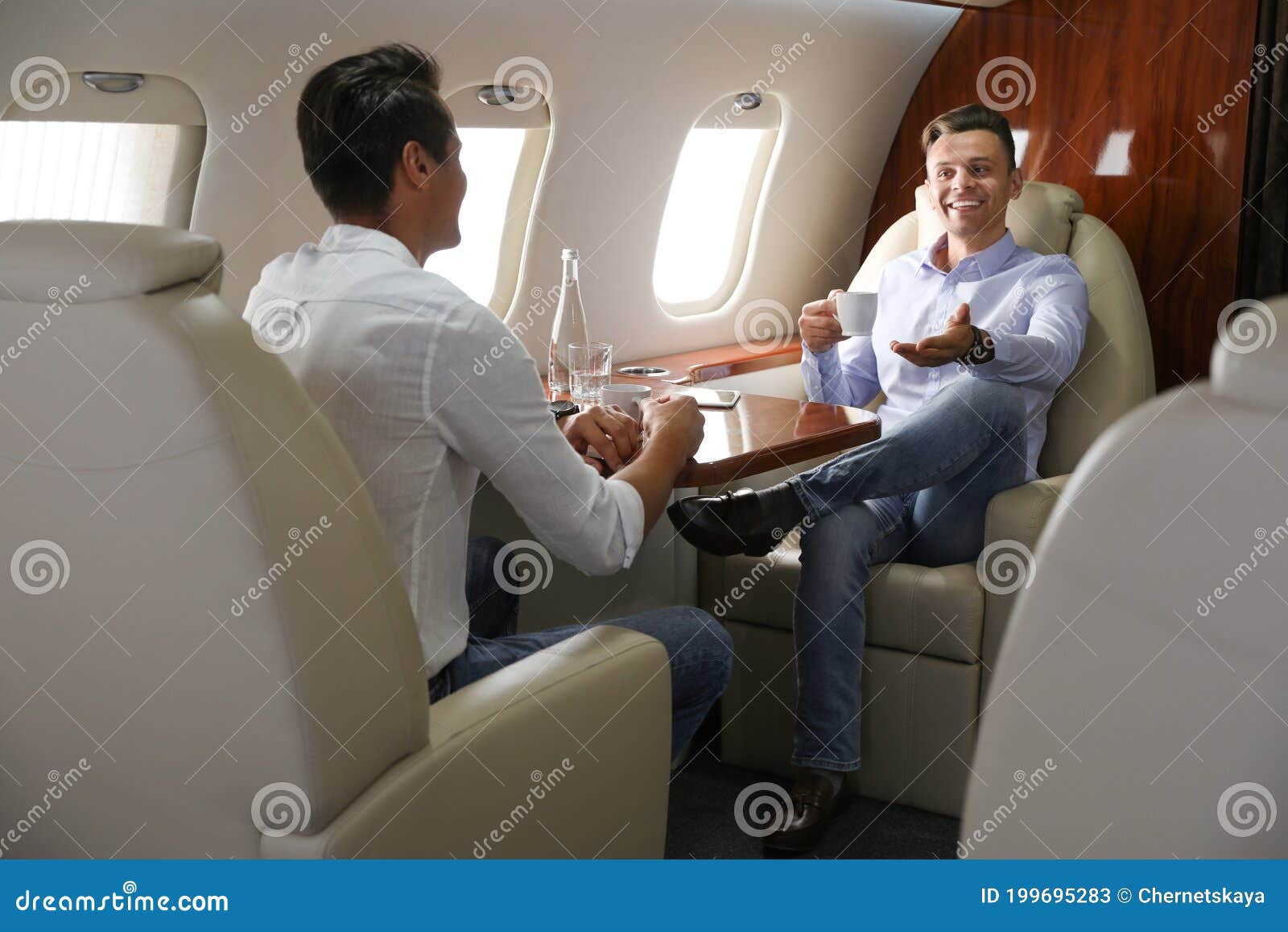 Young Men Talking during Flight. Air Travel Stock Image - Image of ...