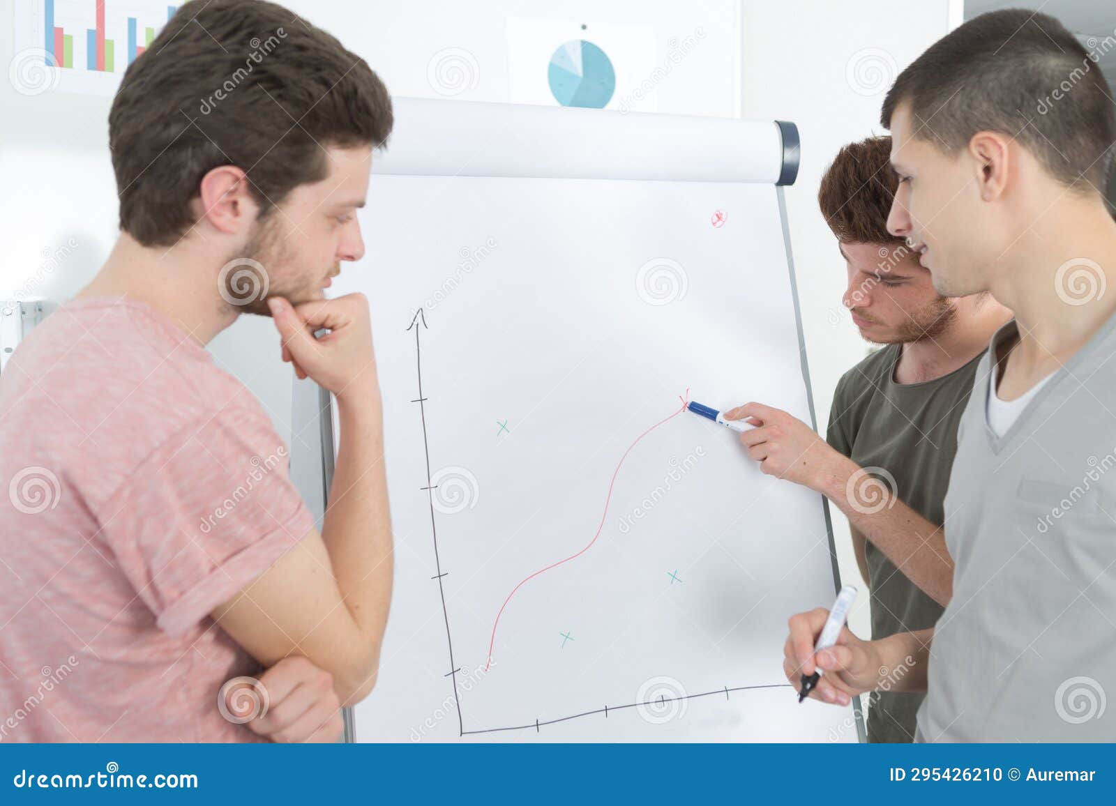 Young Men Tracing Graph on Flip Chart Stock Photo - Image of chart ...
