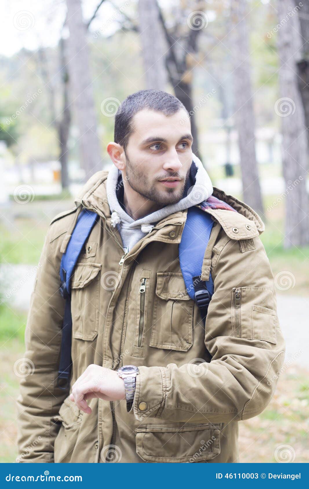 Young Men Watching His Clock Stock Image - Image of adult, time: 46110003