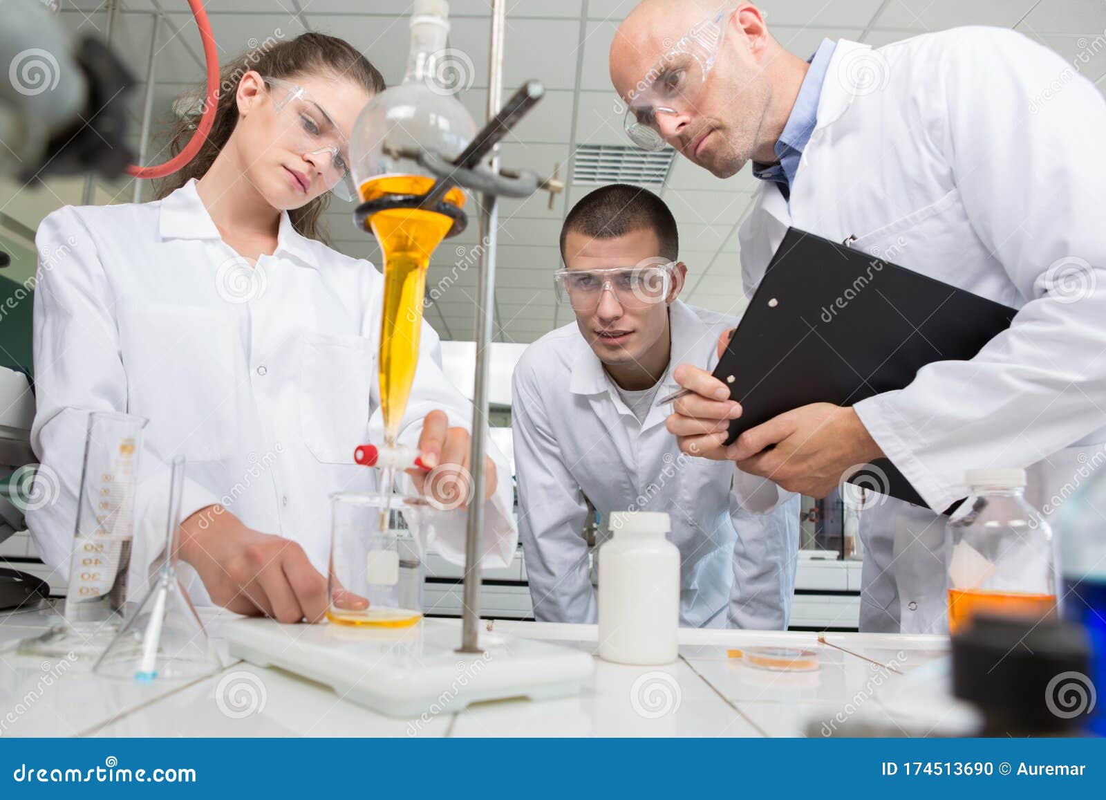 Young Men and Woman in Laboratory with Flask Stock Photo - Image of ...