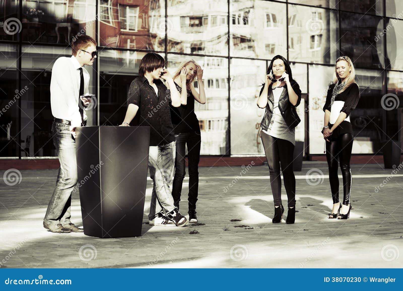 Young Fashion People Calling on Cell Phones on City Street Stock Photo ...