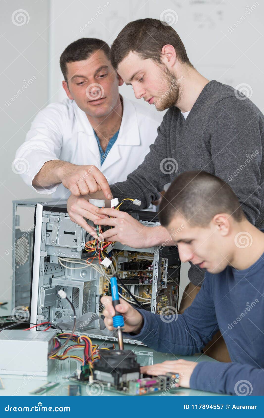 Young Men Working on Dismantled Computer Stock Image - Image of ...