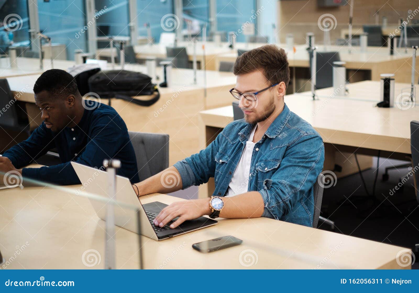 Young Men Working on a Laptops in Public Library Stock Image - Image of ...