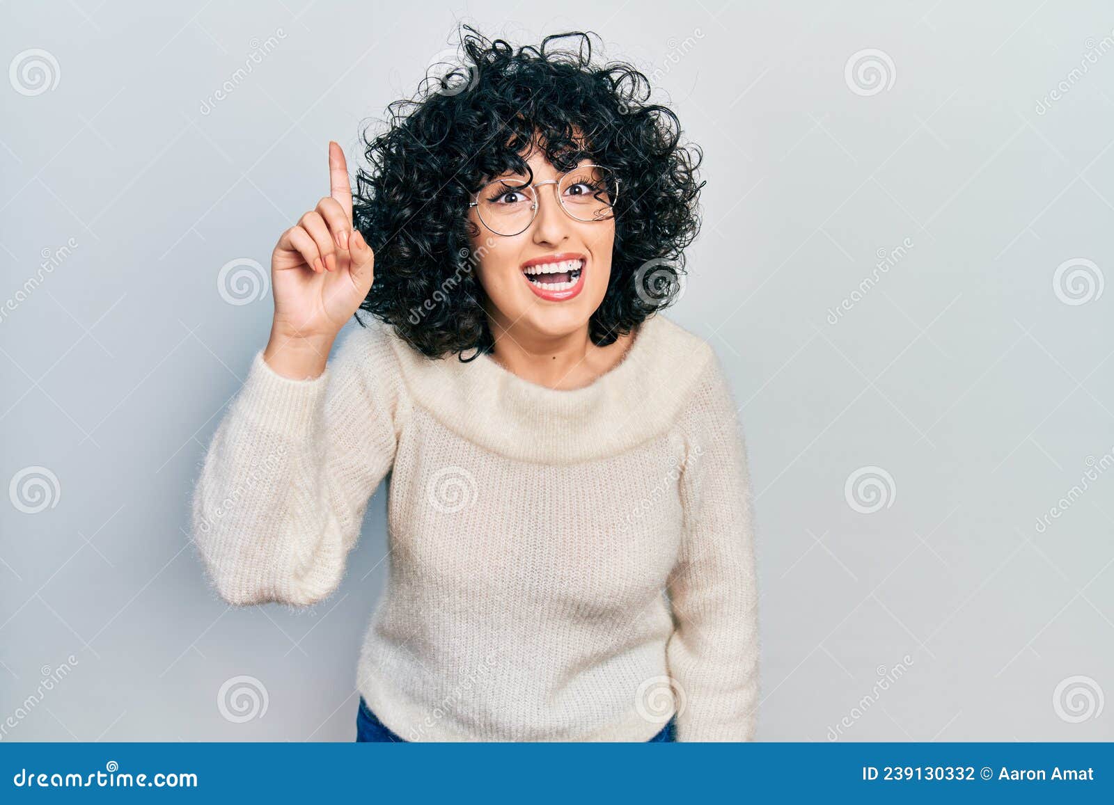 Young Middle East Woman Wearing Casual White Tshirt Pointing Finger Up