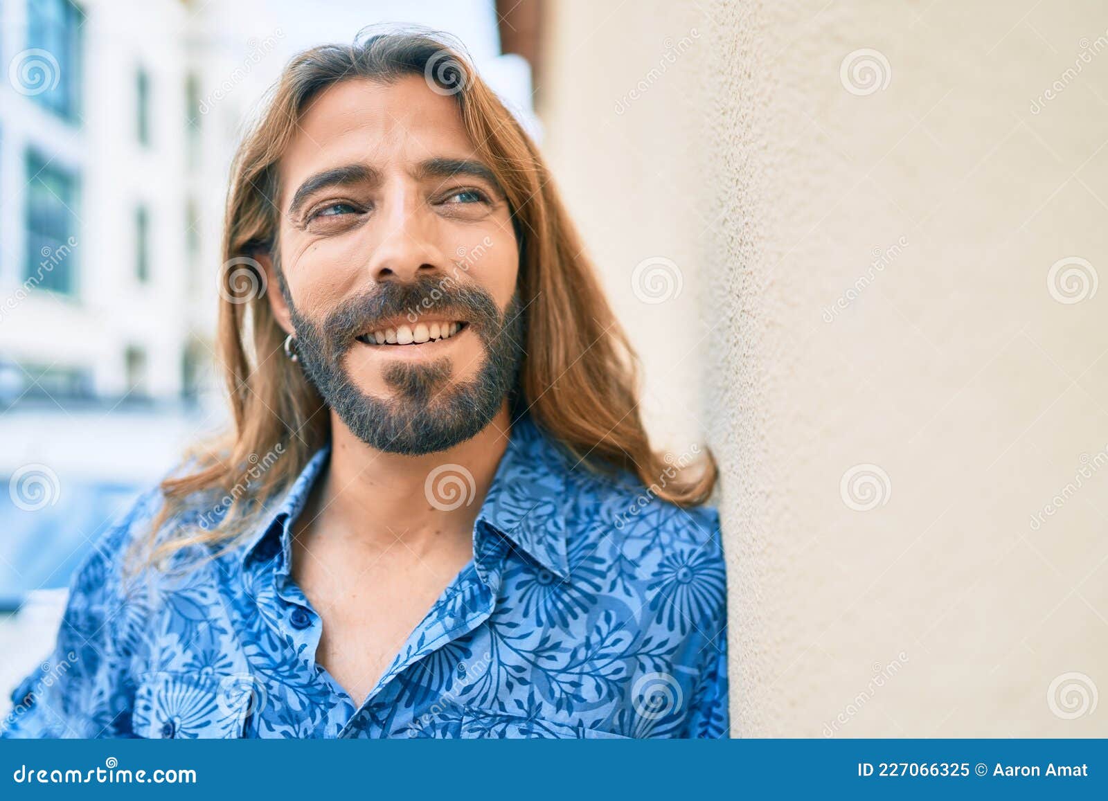 Young Middle Eastern Man Smiling Happy Leaning on the Wall at the City ...