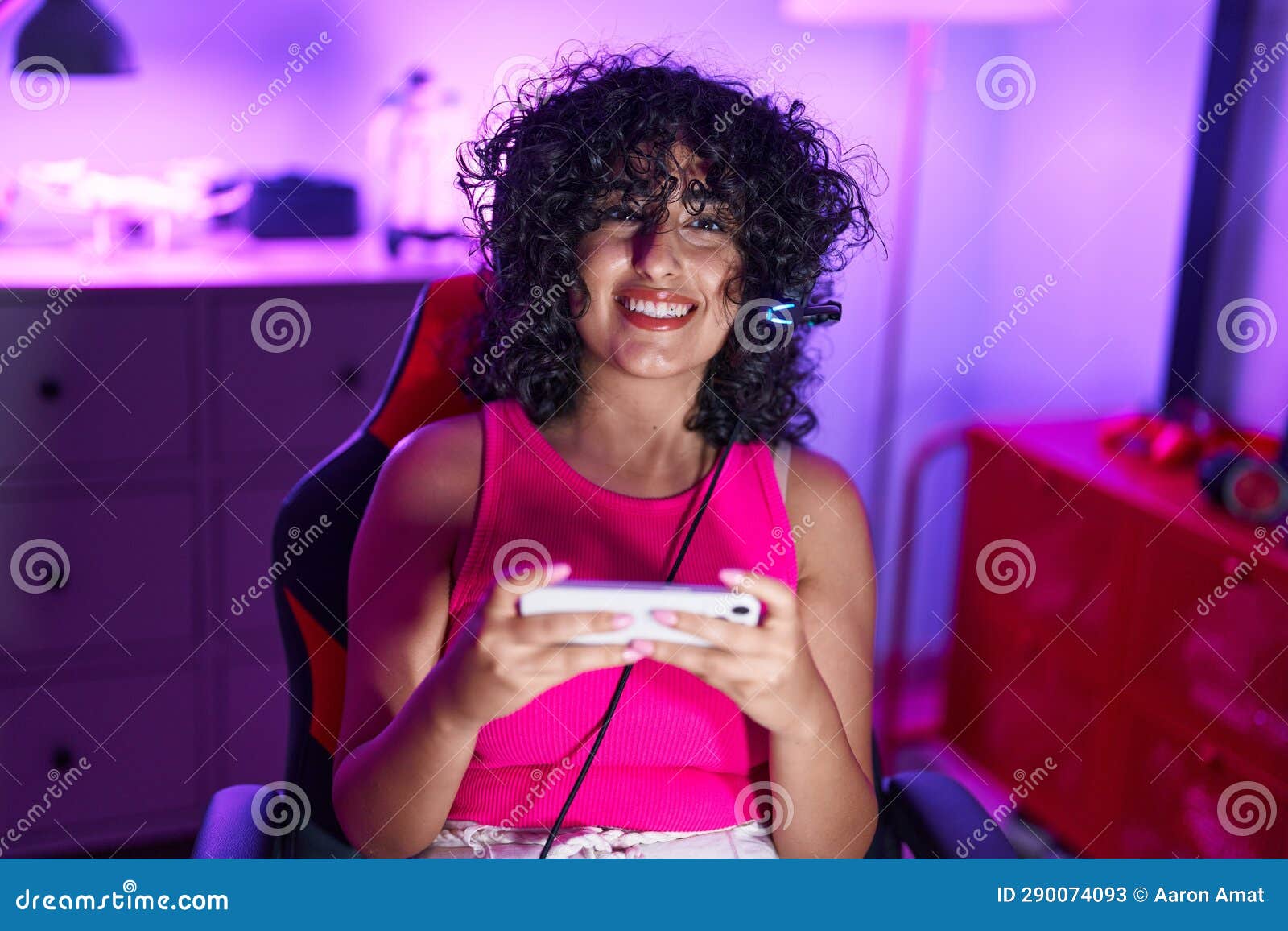 Young Middle Eastern Woman Streamer Playing Video Game Using Smartphone ...