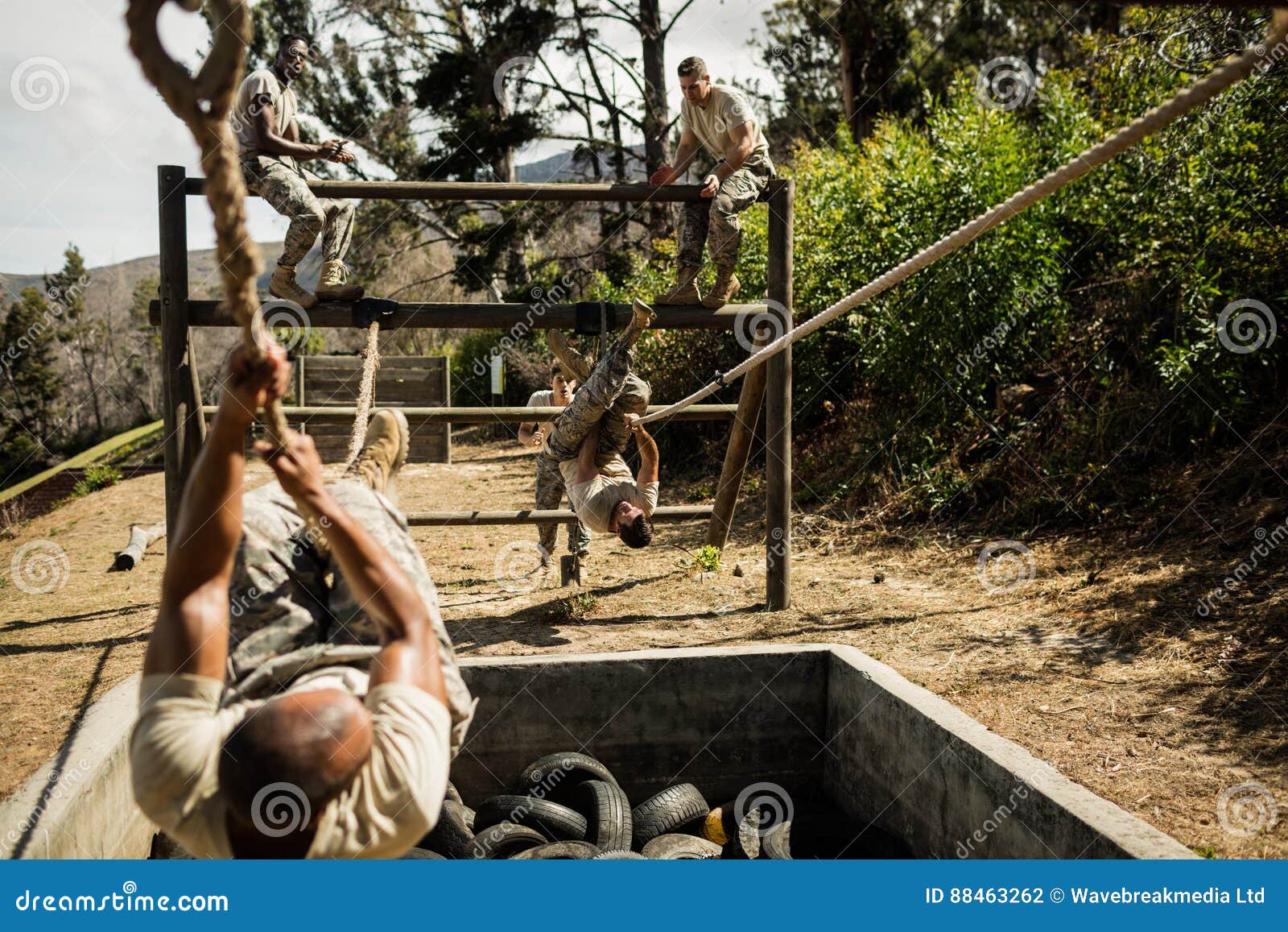 Young Military Soldiers Practicing Rope Climbing during Obstacle Course ...