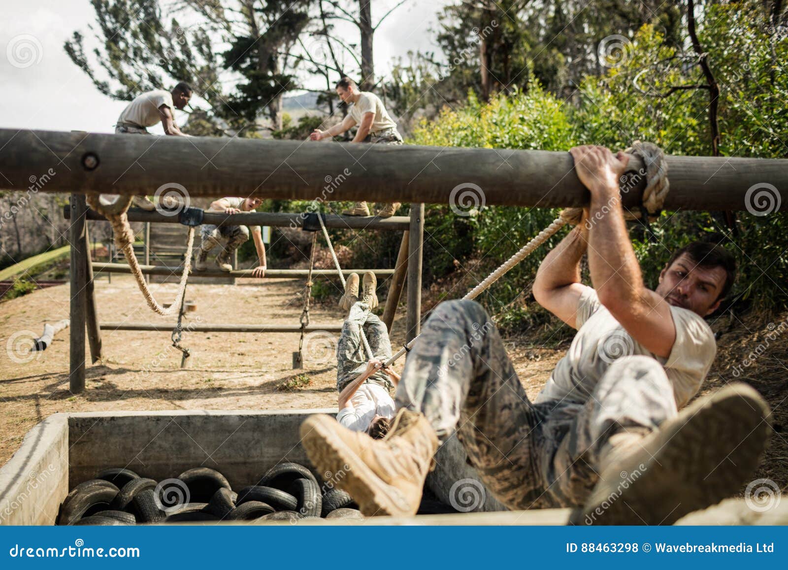 Young Military Soldiers Practicing Rope Climbing during Obstacle Course ...