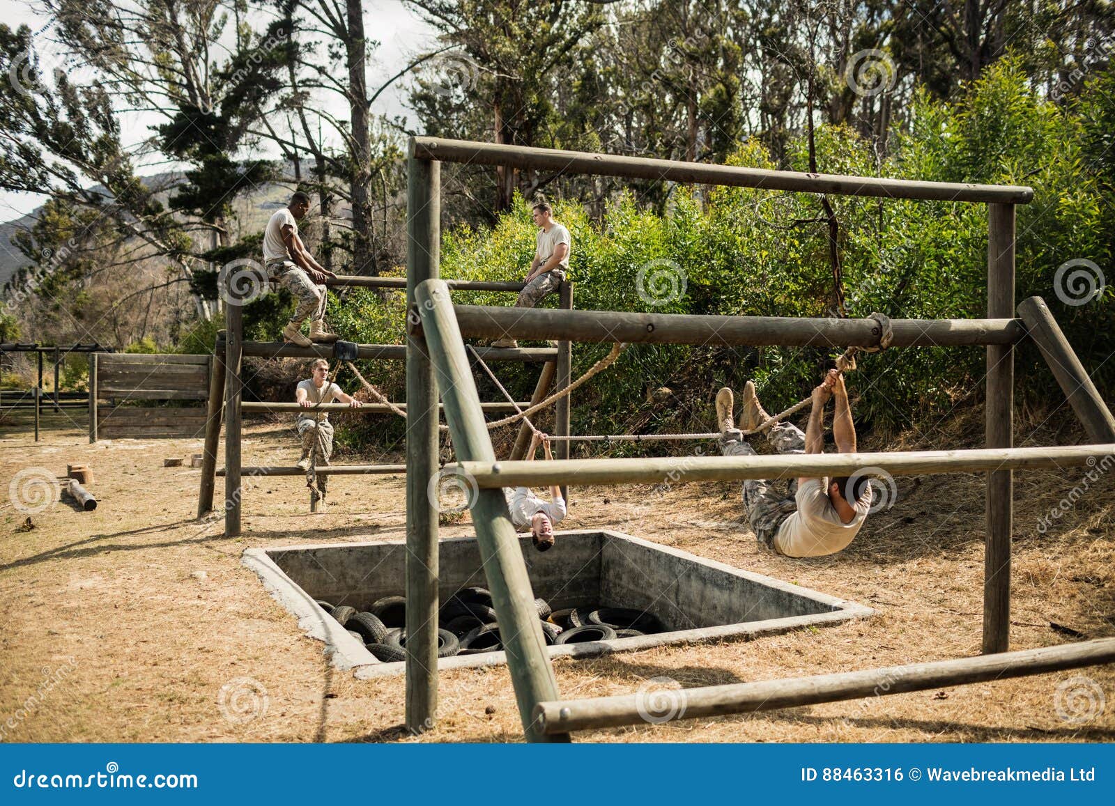 Young Military Soldiers Practicing Rope Climbing during Obstacle Course ...