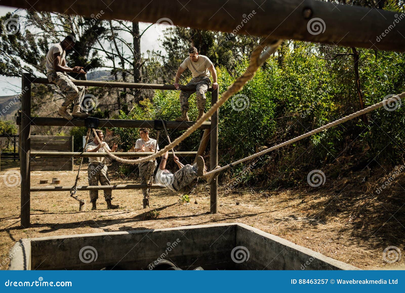 Young Military Soldiers Practising Rope Climbing during Obstacle Course ...
