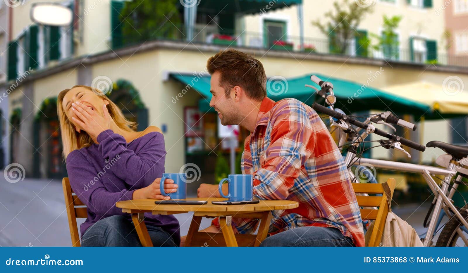 Young Millennial Laughing at Her Date`s Jokes Stock Photo - Image of ...