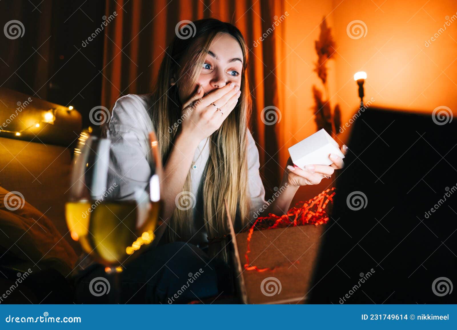 Young Millennial Woman Open Gift in Front Laptop Computer during Video ...