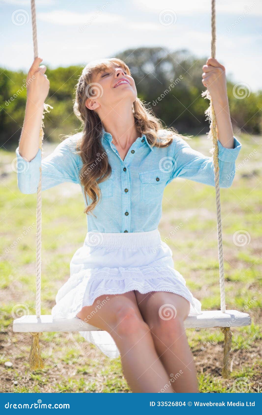 Young Model Relaxing while Sitting on Swing Stock Photo - Image of ...