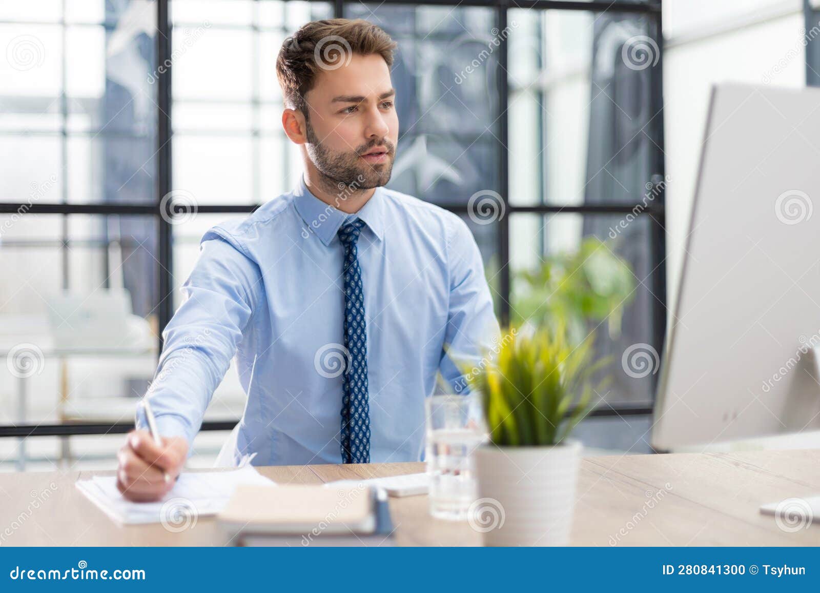 Young Modern Business Man Working Using Computer while Sitting in the ...