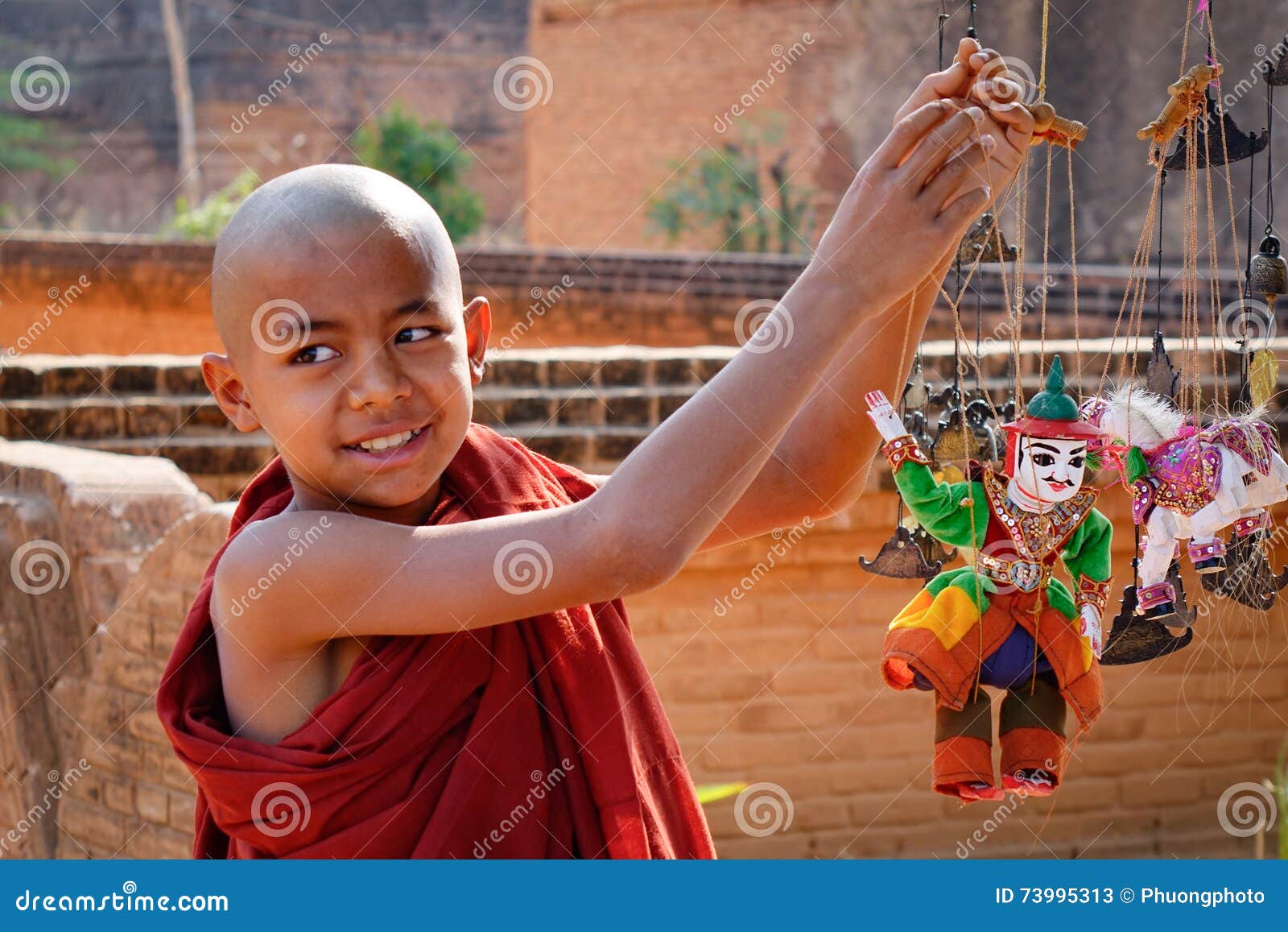 A Young Monk Playing with Puppets in Bagan, Myanmar Editorial Stock ...