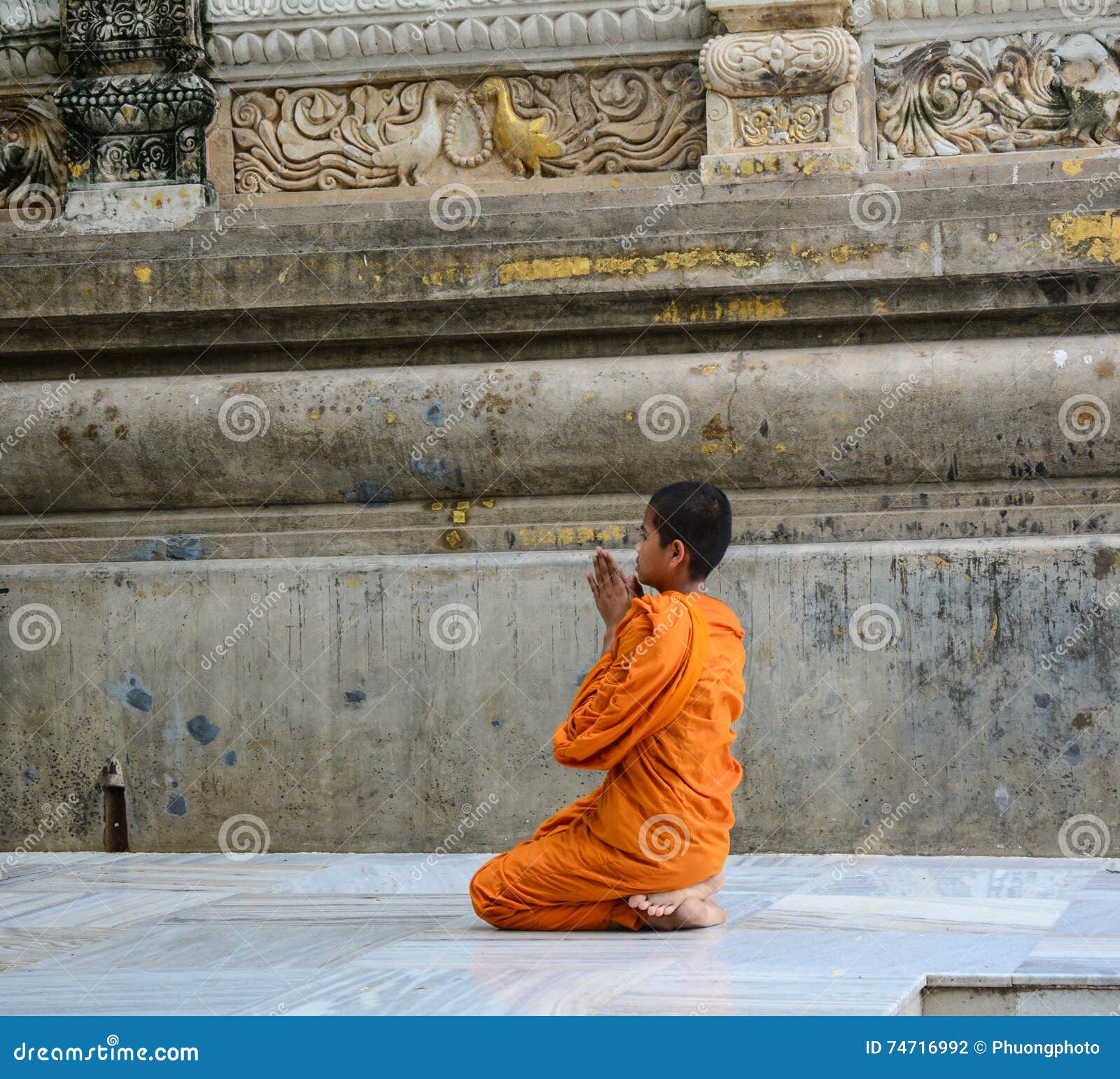 A Young Monk Praying at the Buddhist Temple in Delhi, India Editorial ...