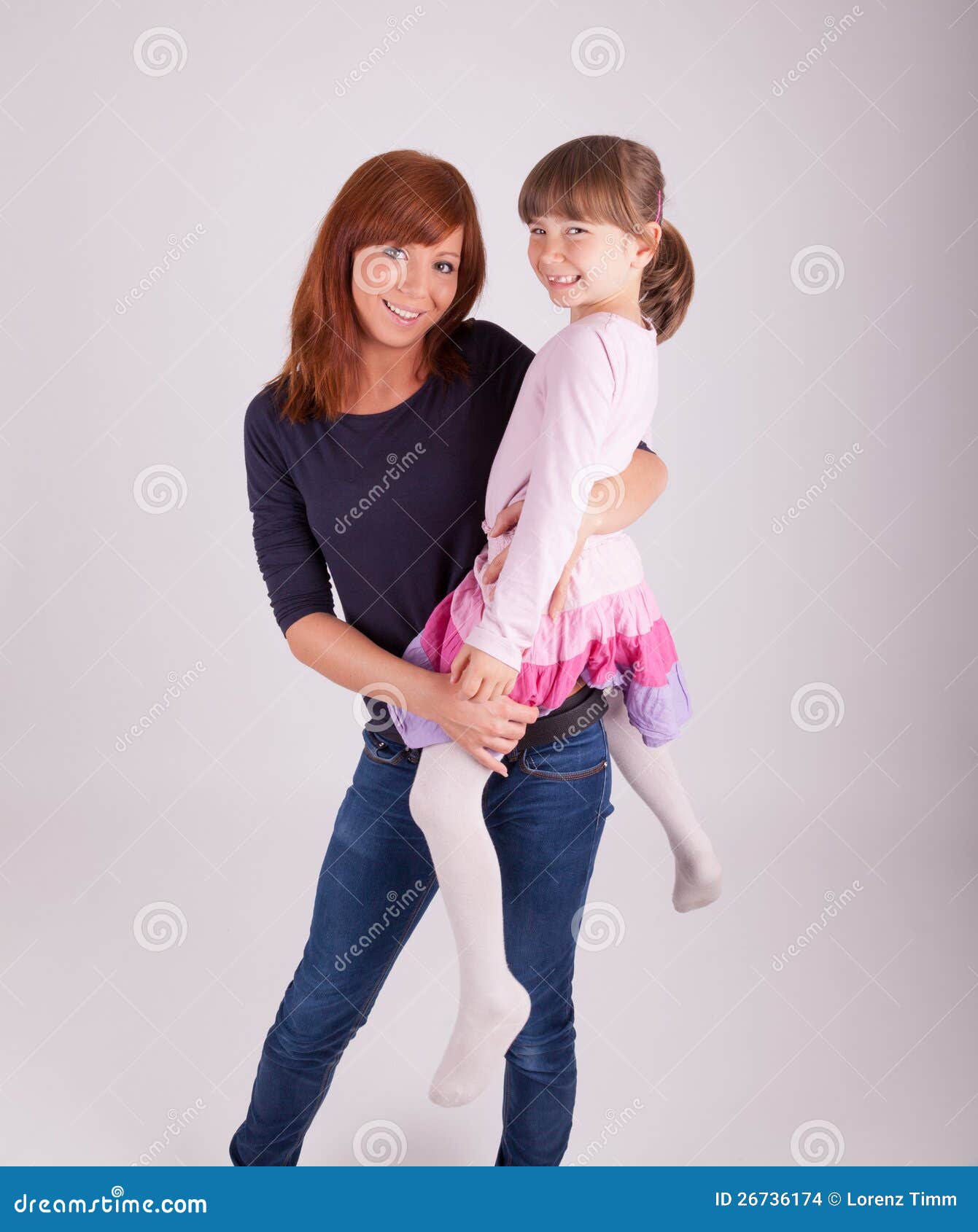 A Young Mother is Carrying Her Daughter Stock Photo - Image of mother ...