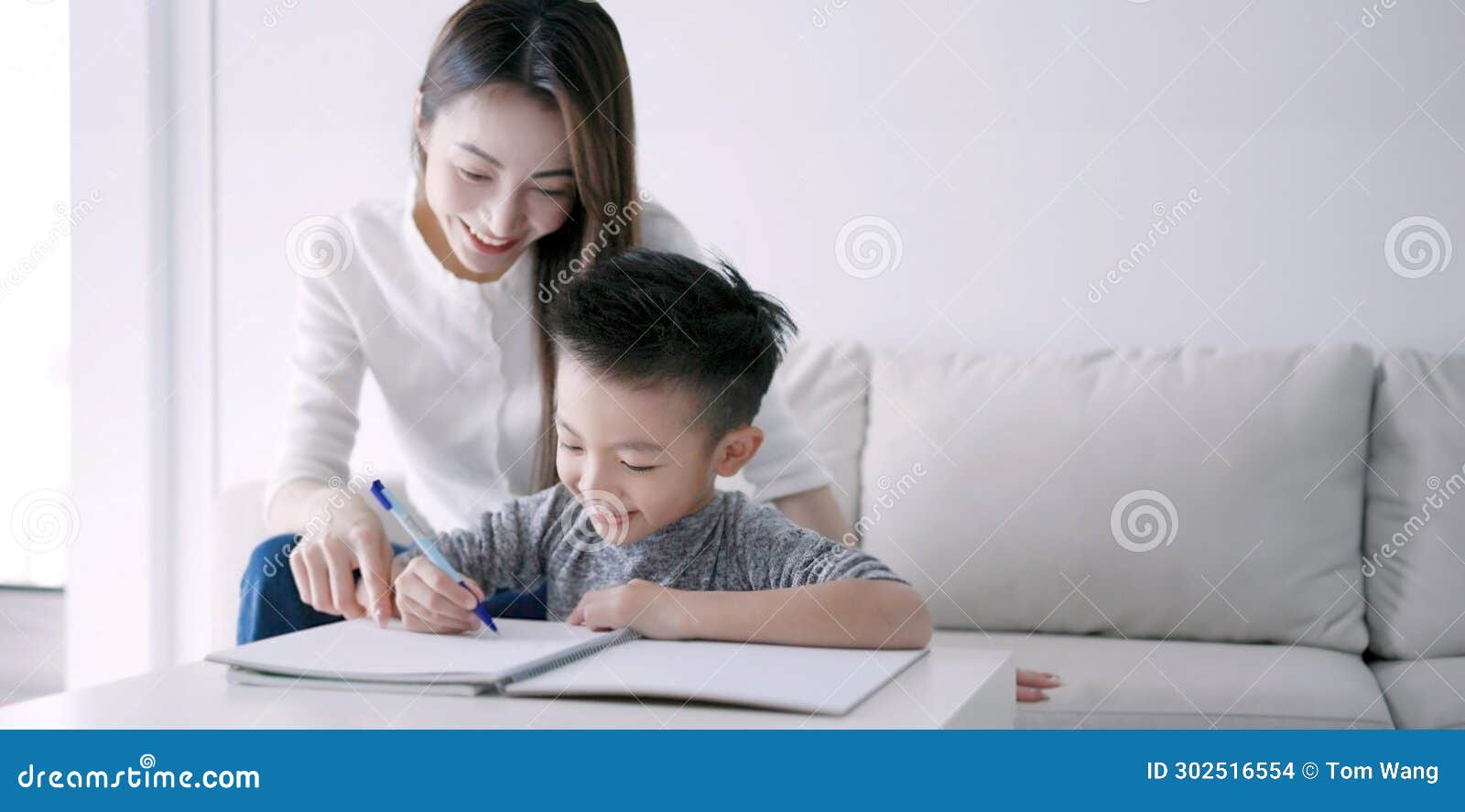 Young Mother Checking Homework Helping Child with Study at Home Stock ...