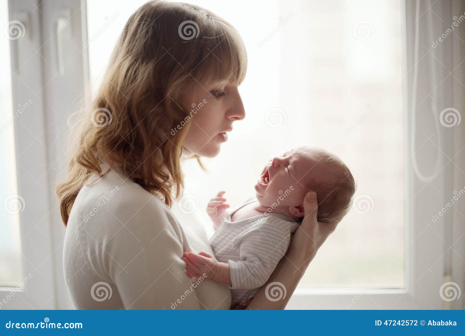 Young Mother with Crying Baby Stock Photo - Image of funny, emotion ...