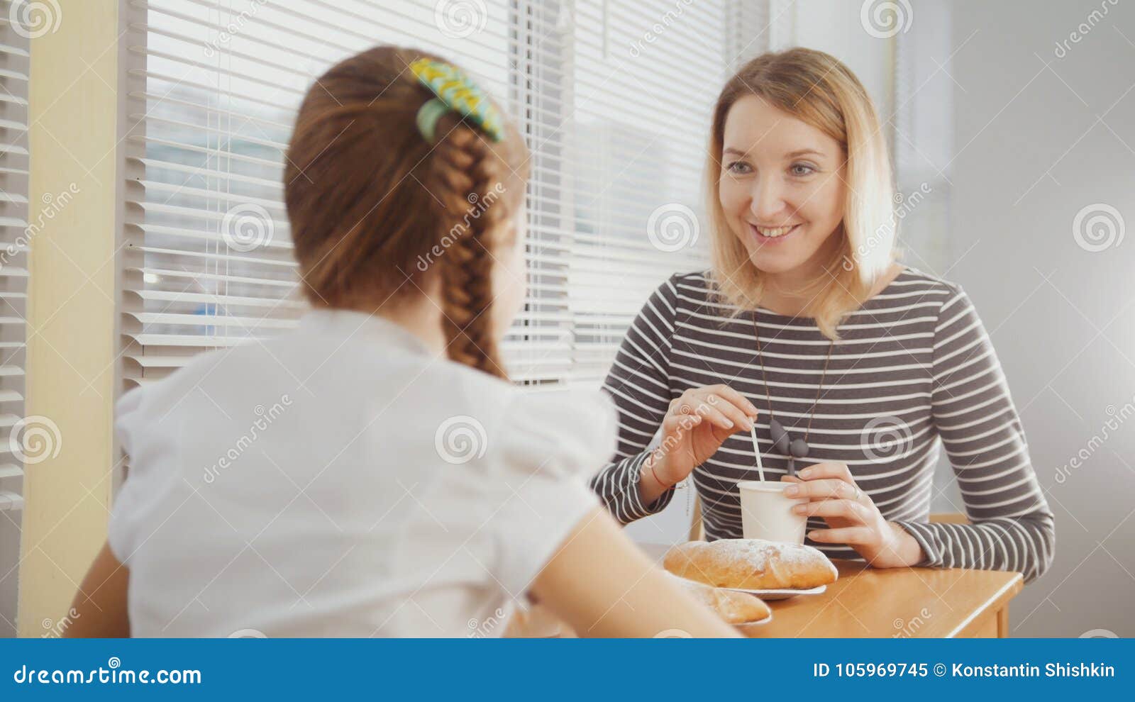 Young Mother and Daughter are Eating Pastries at the Bakery Stock Image ...