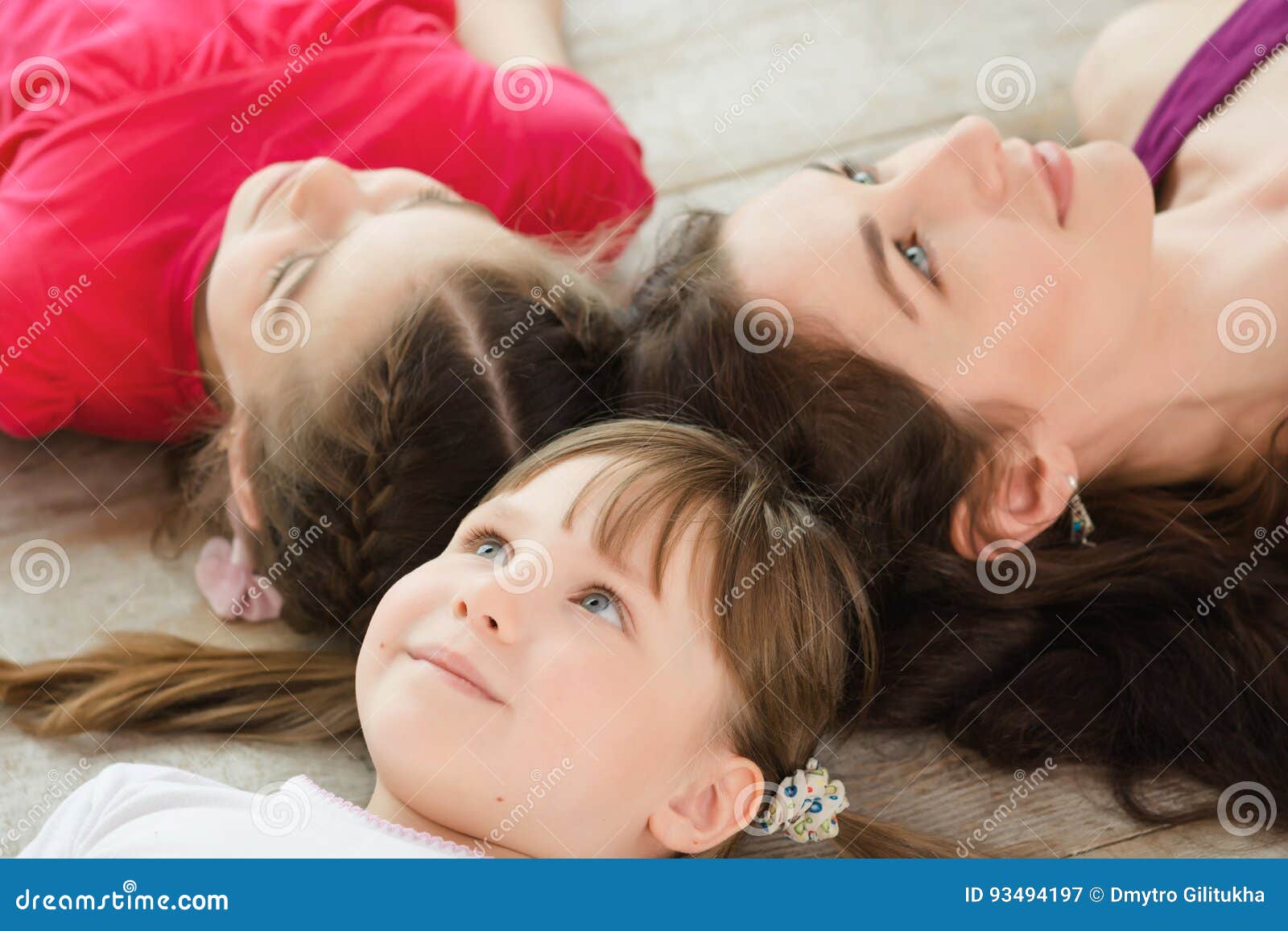 Young Mother and Daughter Lying on the Floor Stock Image - Image of ...