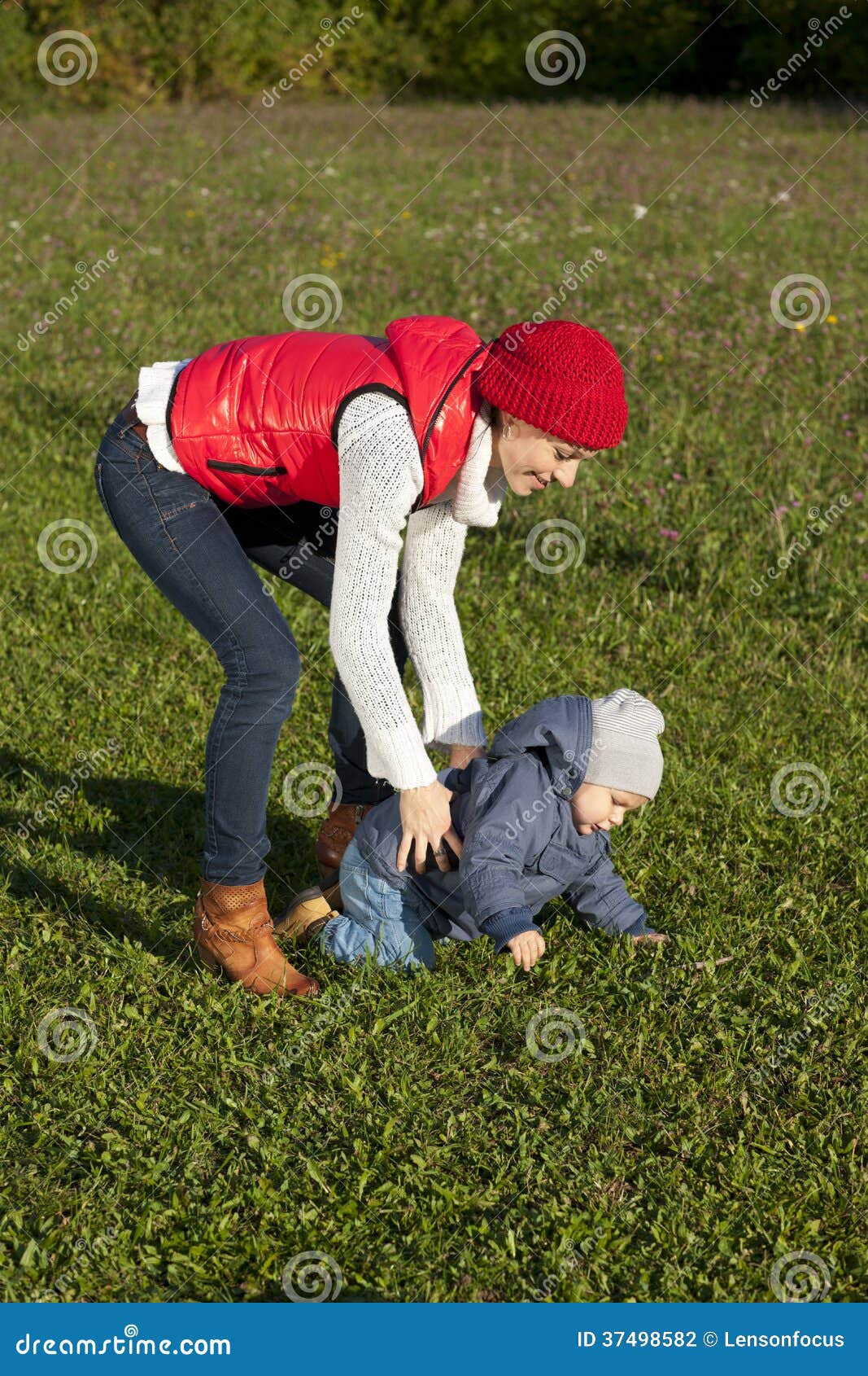 Young Mother Helps Her Young Child Stock Photo - Image of happy, family ...