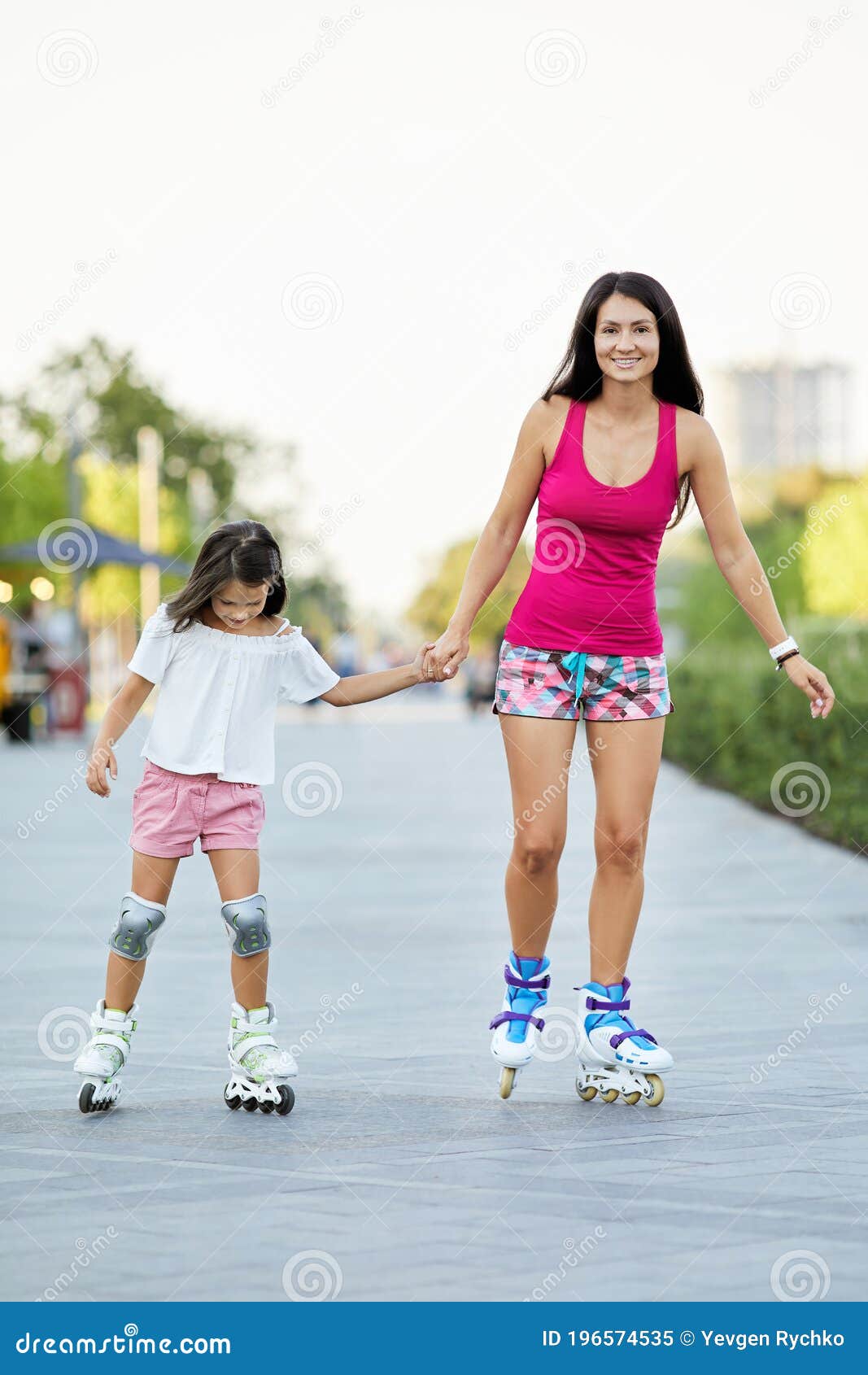Young Mother and Her Little Daughter Rollerskating Stock Image - Image ...