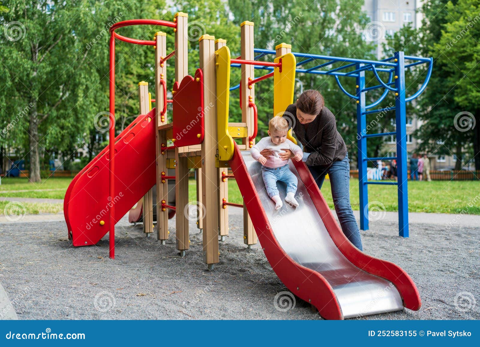 Young Mother Playing with Her Baby on the Playground. Stock Image ...