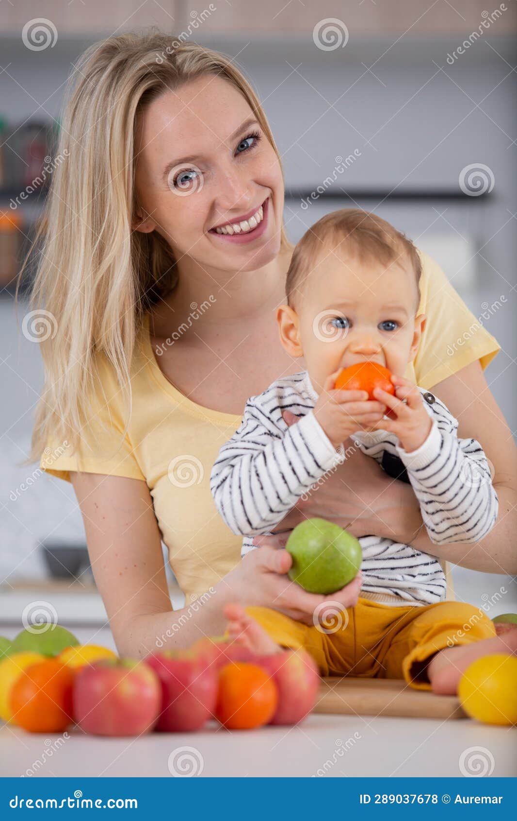 Young Mother Posing with Baby and Fruits Stock Photo - Image of health ...