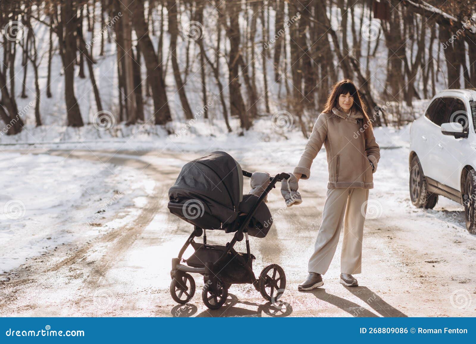 A Young Mother Posing with a Baby Stroller in Winter Morning. Stock ...
