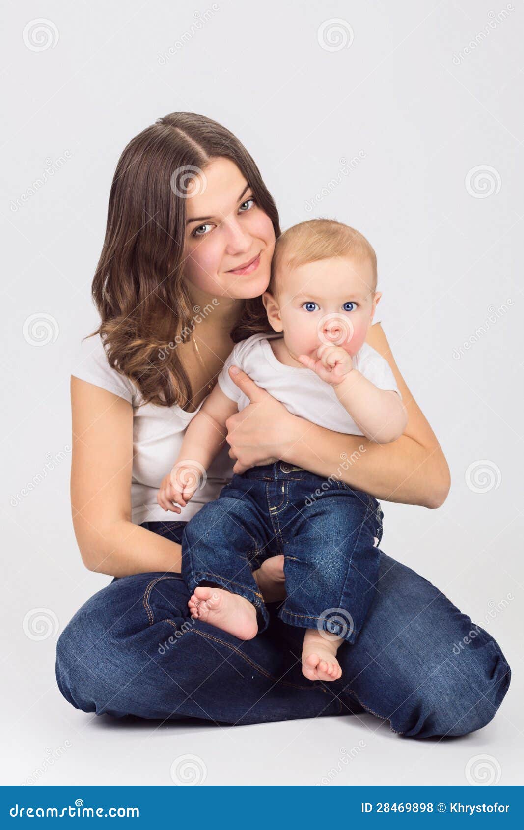 Young Mother Sitting with Her Child Stock Photo - Image of jeans ...