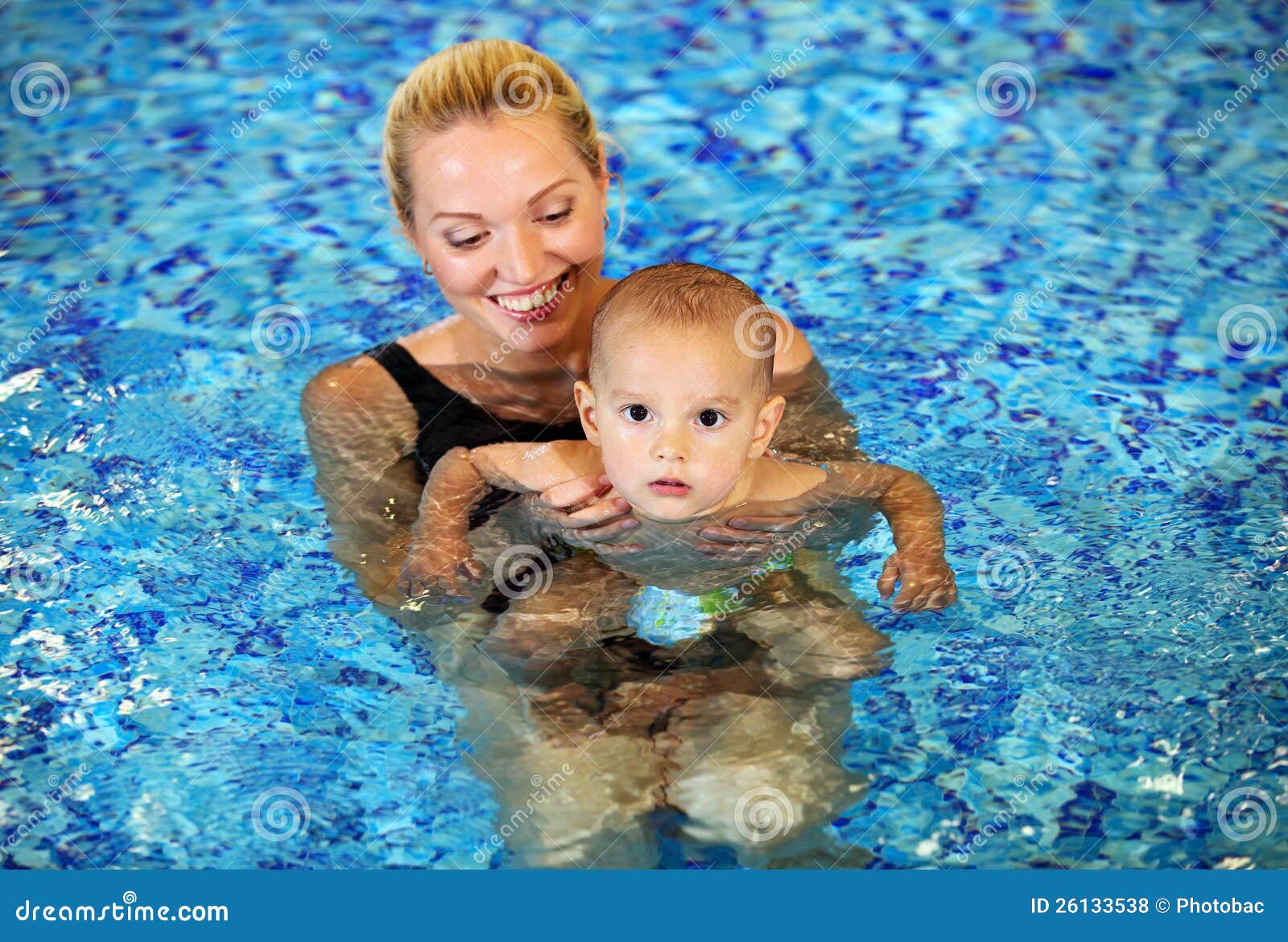 Young Mother with Son in a Swimming Pool Stock Photo - Image of ...