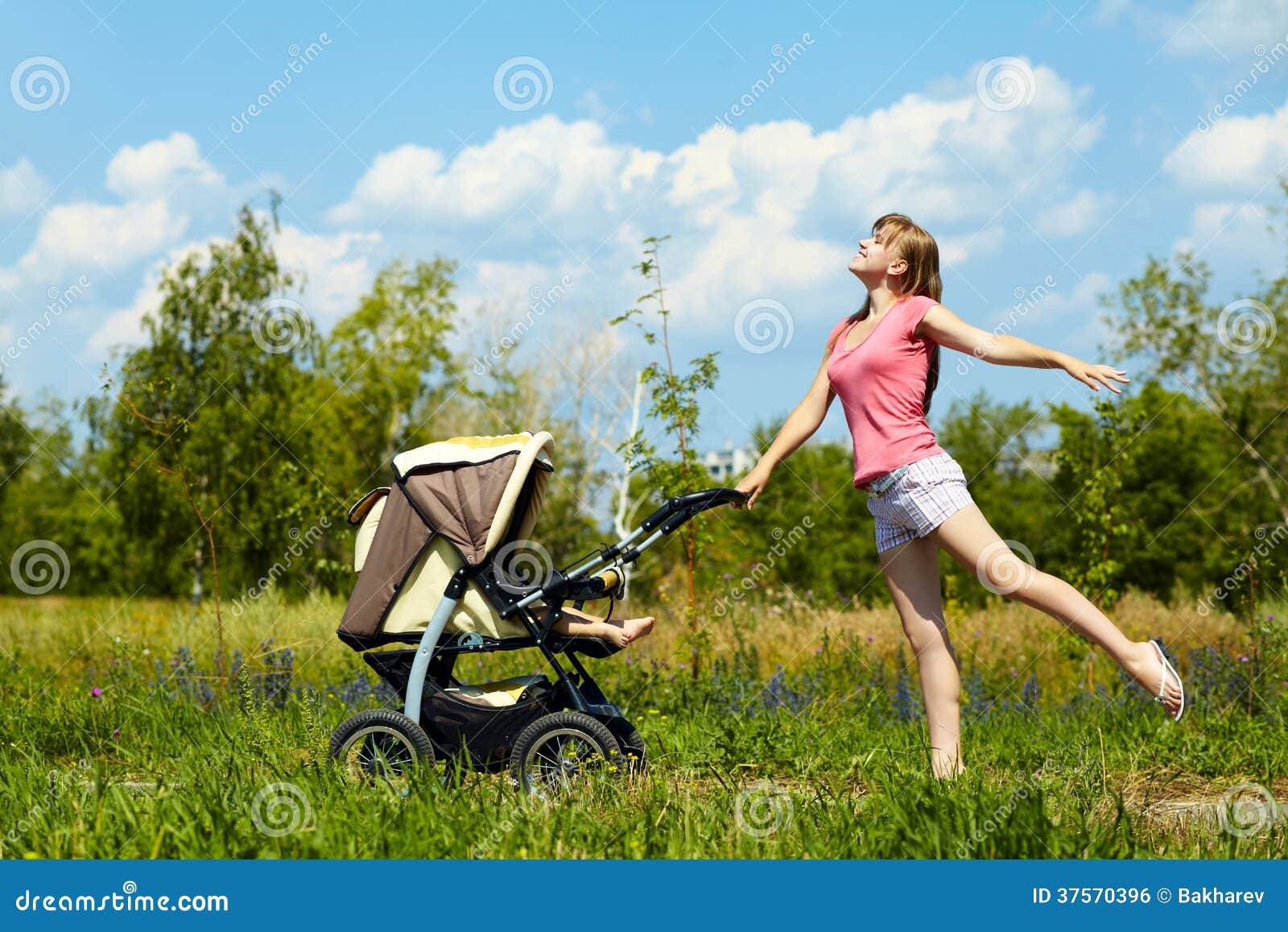 Young Mother with a Stroller Stock Photo - Image of outdoors, stroll ...
