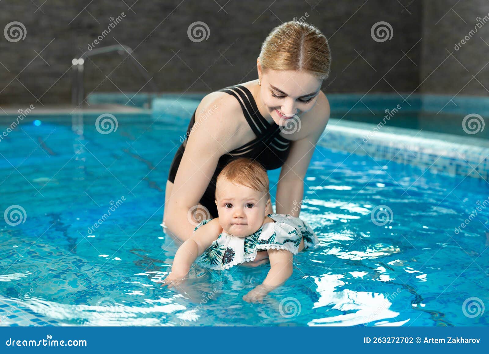 Young Mother, Swimming Instructor and Happy Little Girl in the Pool ... Young Mother, Swimming Instructor and Happy Little Girl in the Pool ...