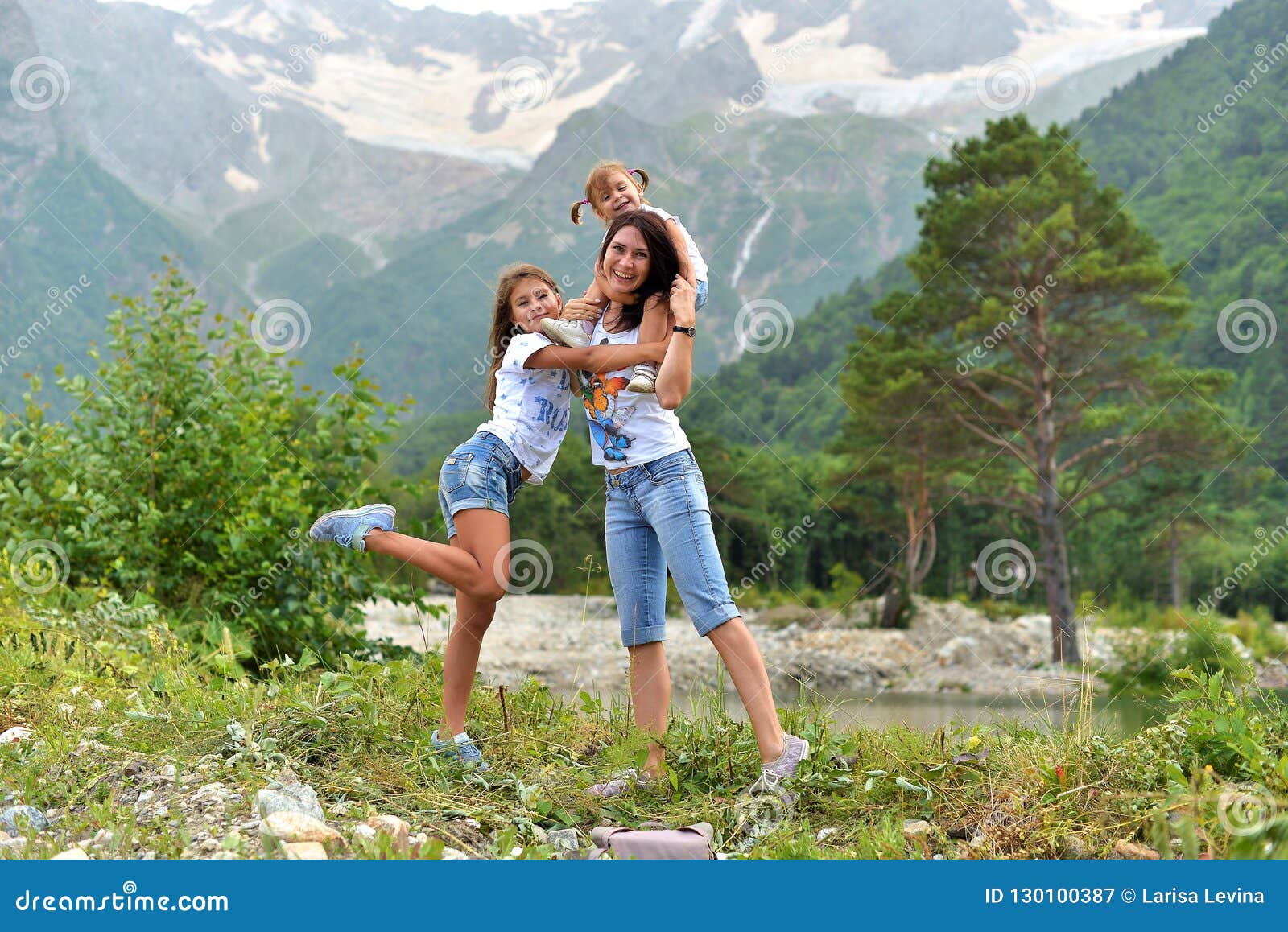 Young Mother with Two Daughters Relax in Nature in the Mountains. Stock ...
