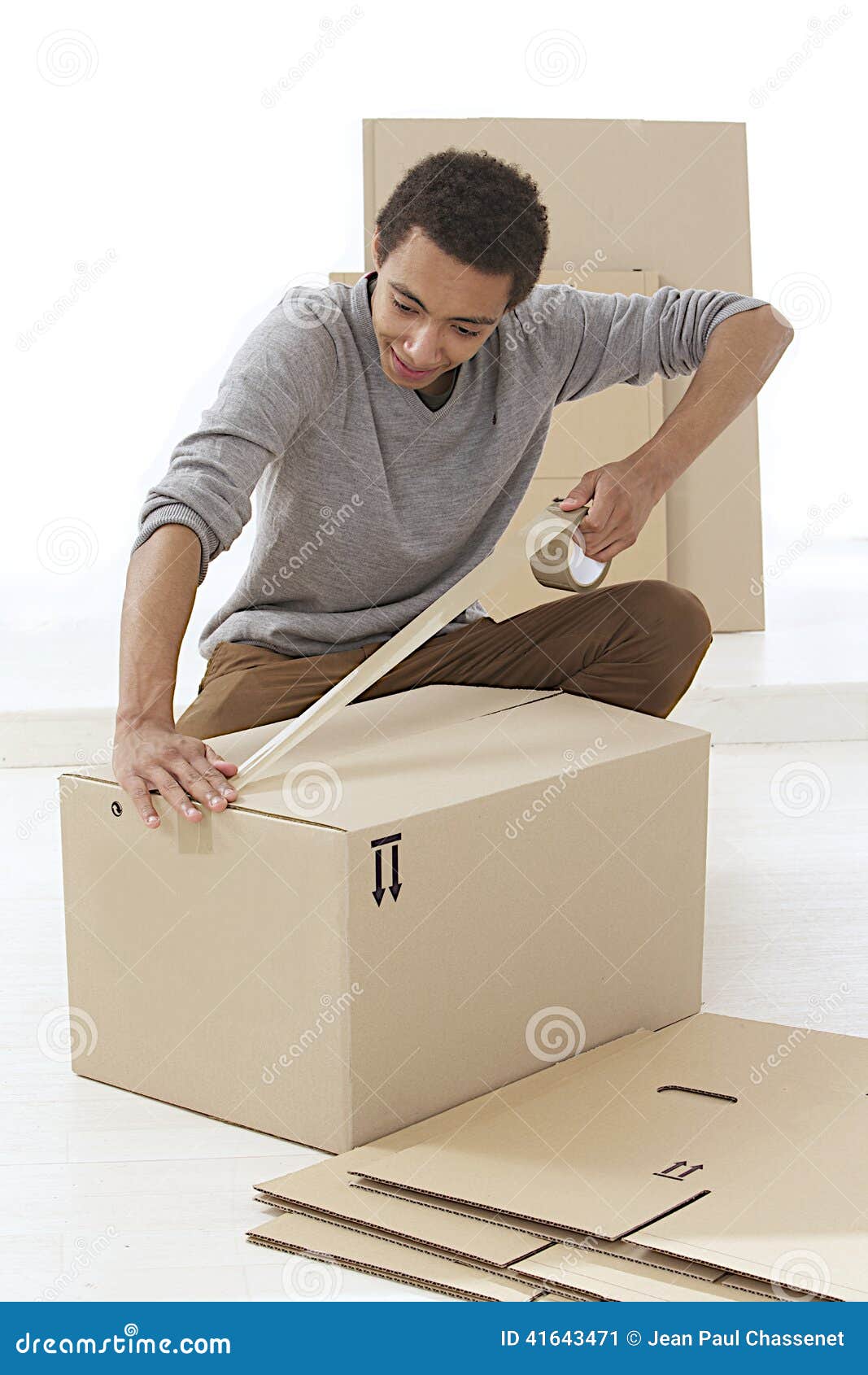 Young Mulatto Man Closing a Moving Box Stock Image - Image of boxes ...