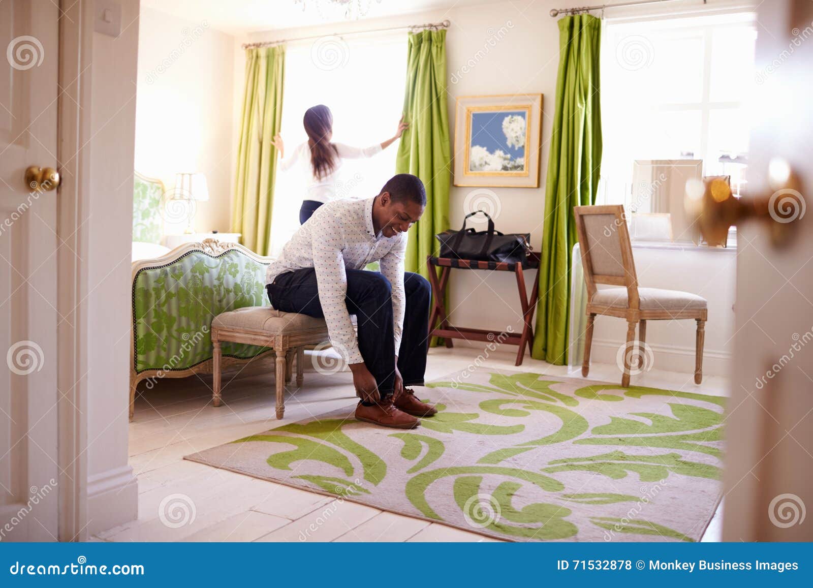 Young Multi Ethnic Couple Getting Ready in a Hotel Room Stock Photo ...