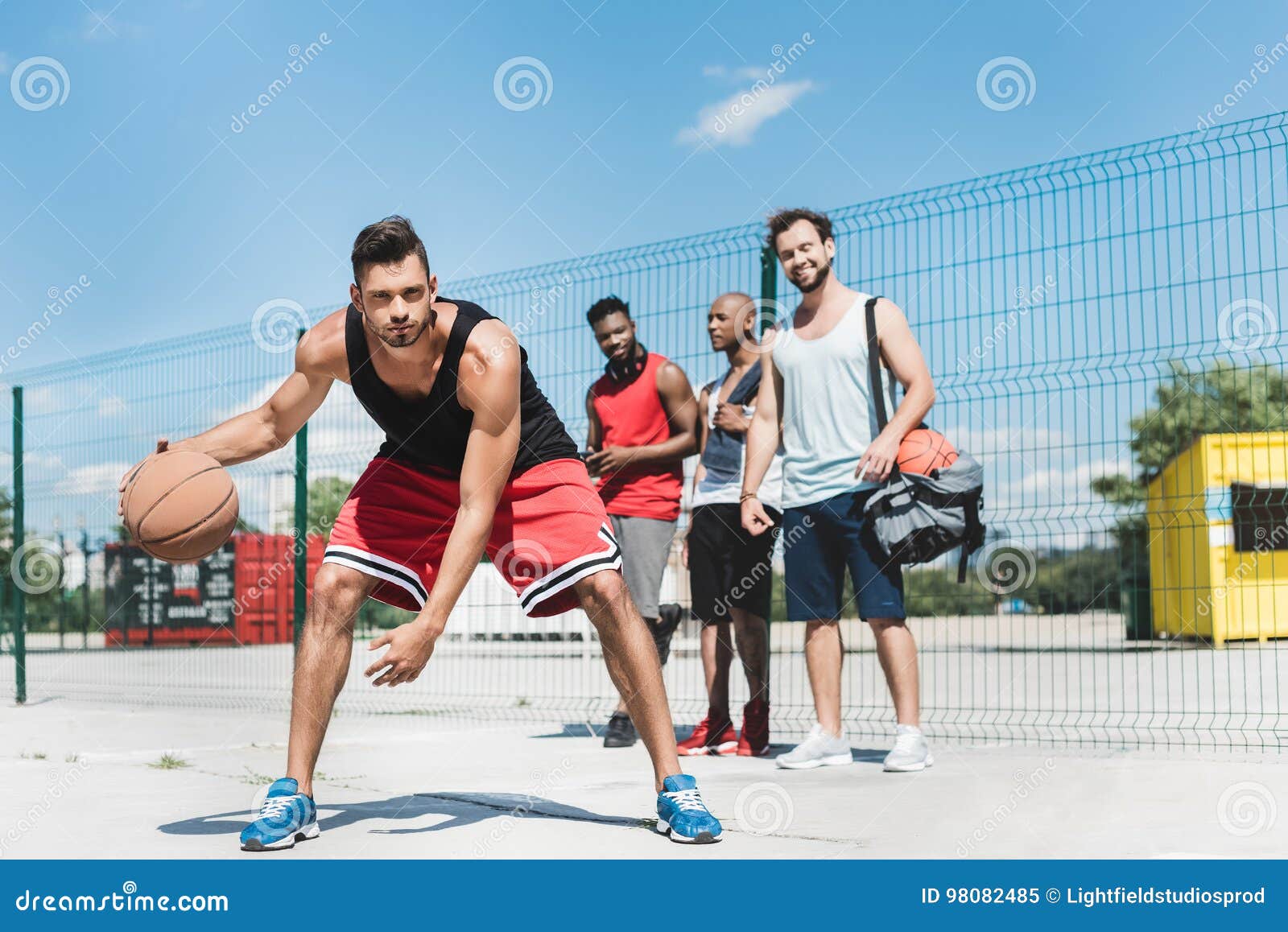 Young Multicultural Men Playing Basketball on Court Stock Image - Image ...